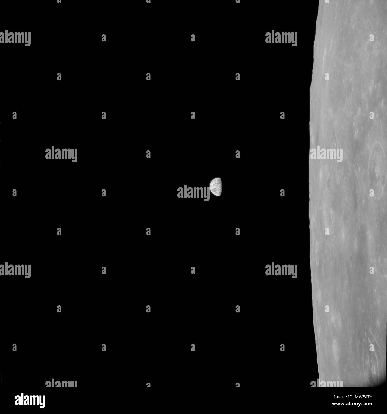 Apollo 11 mission. Lunar orbit with earth in background Stock Photo - Alamy