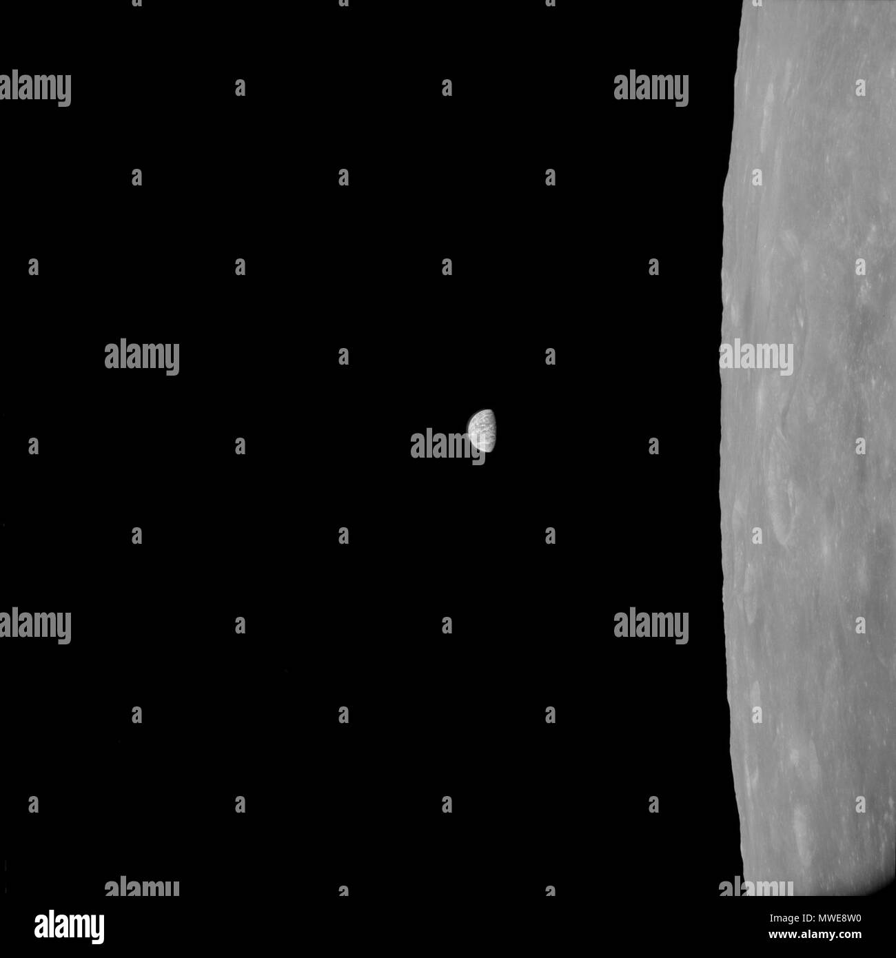 Apollo 11 mission. Lunar orbit with earth in background Stock Photo - Alamy