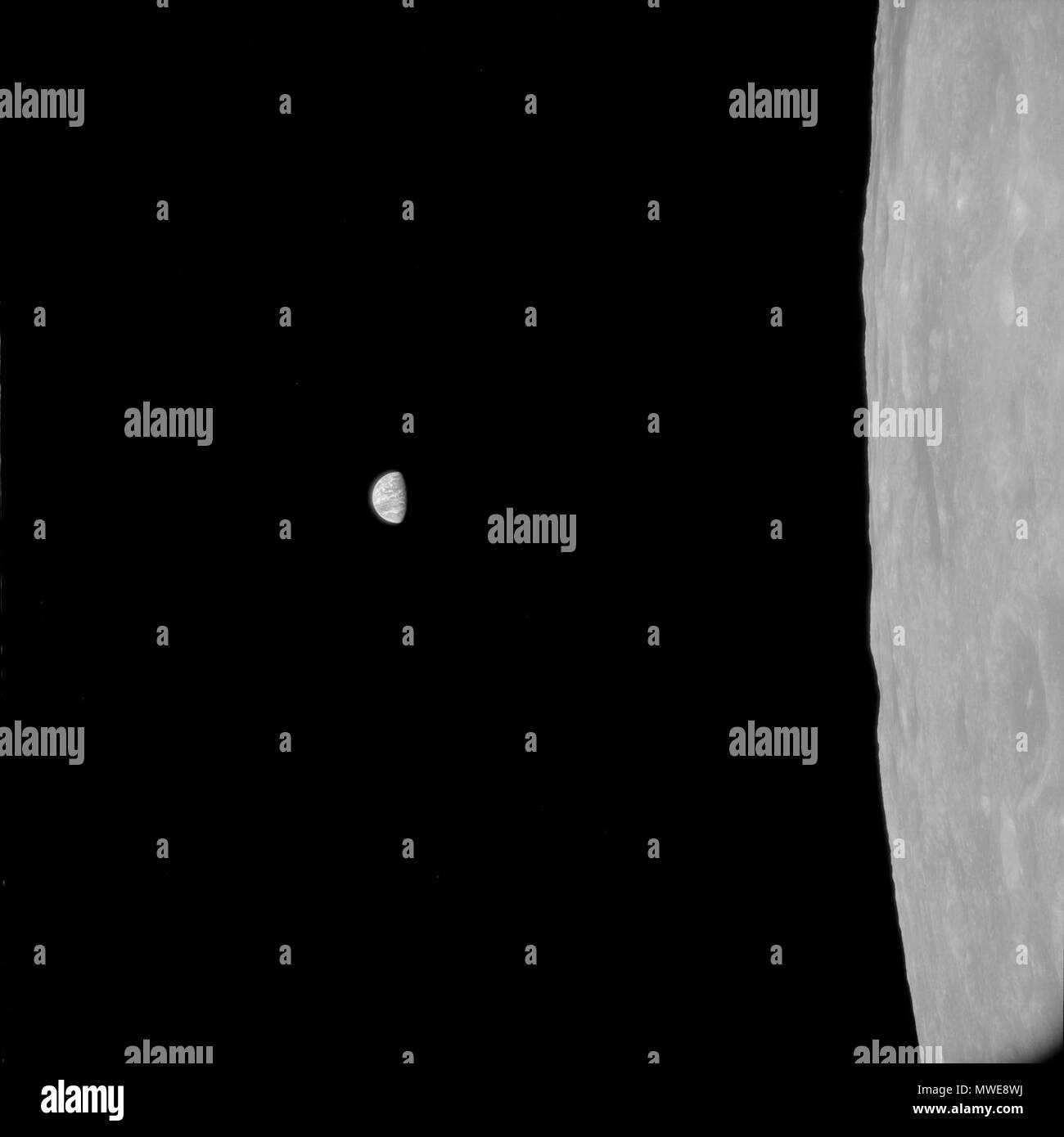 Apollo 11 mission. Lunar orbit with earth in background Stock Photo - Alamy