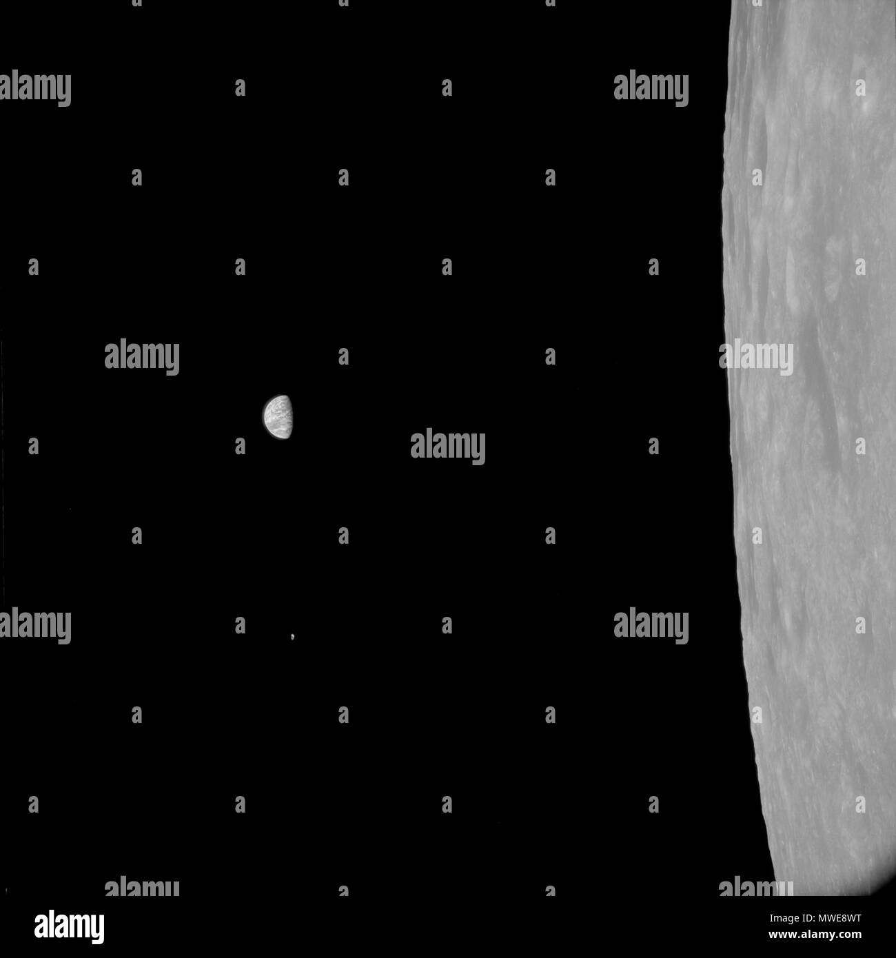 Apollo 11 mission. Lunar orbit with earth in background Stock Photo - Alamy