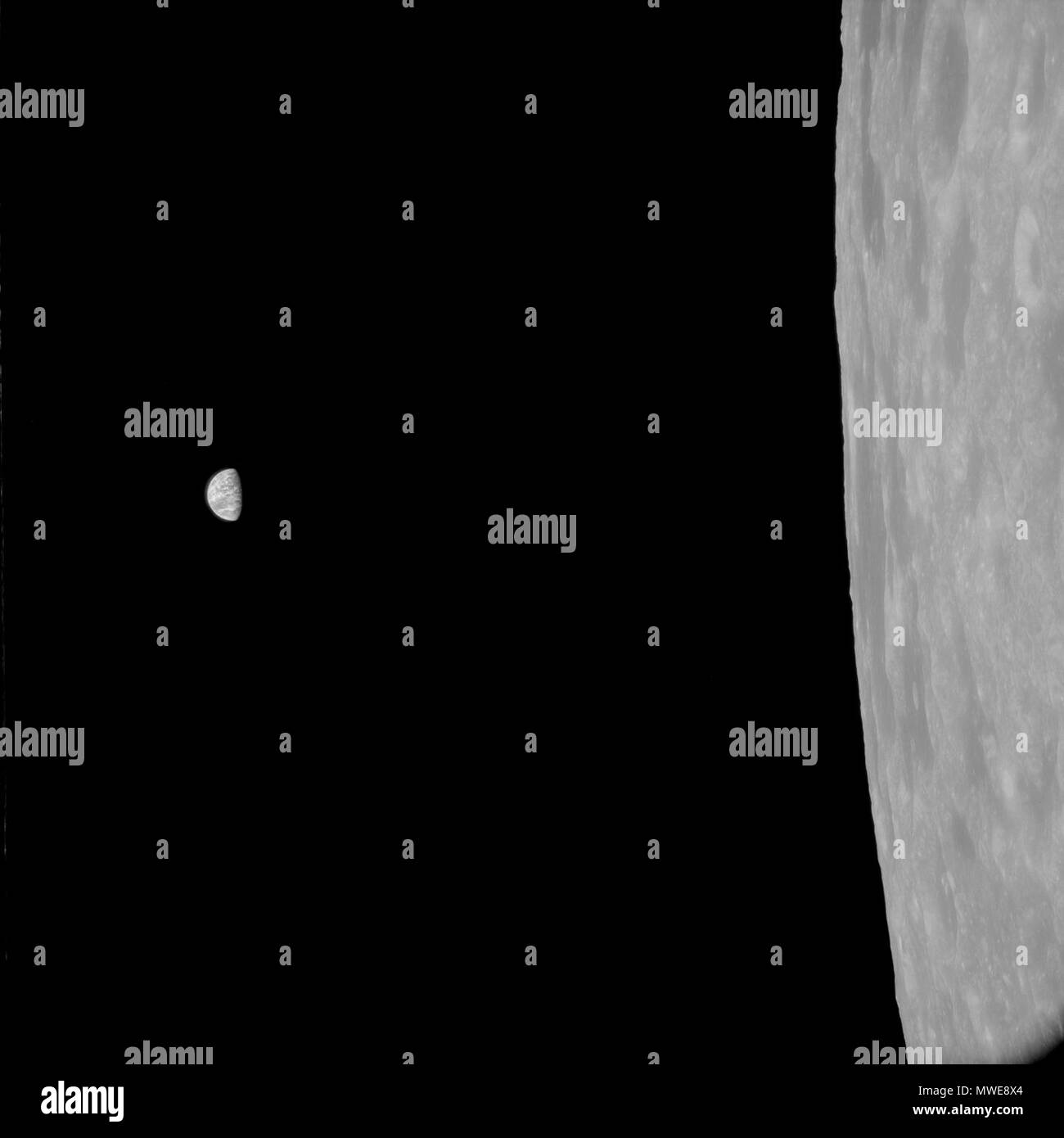 Apollo 11 mission. Lunar orbit with earth in background Stock Photo - Alamy