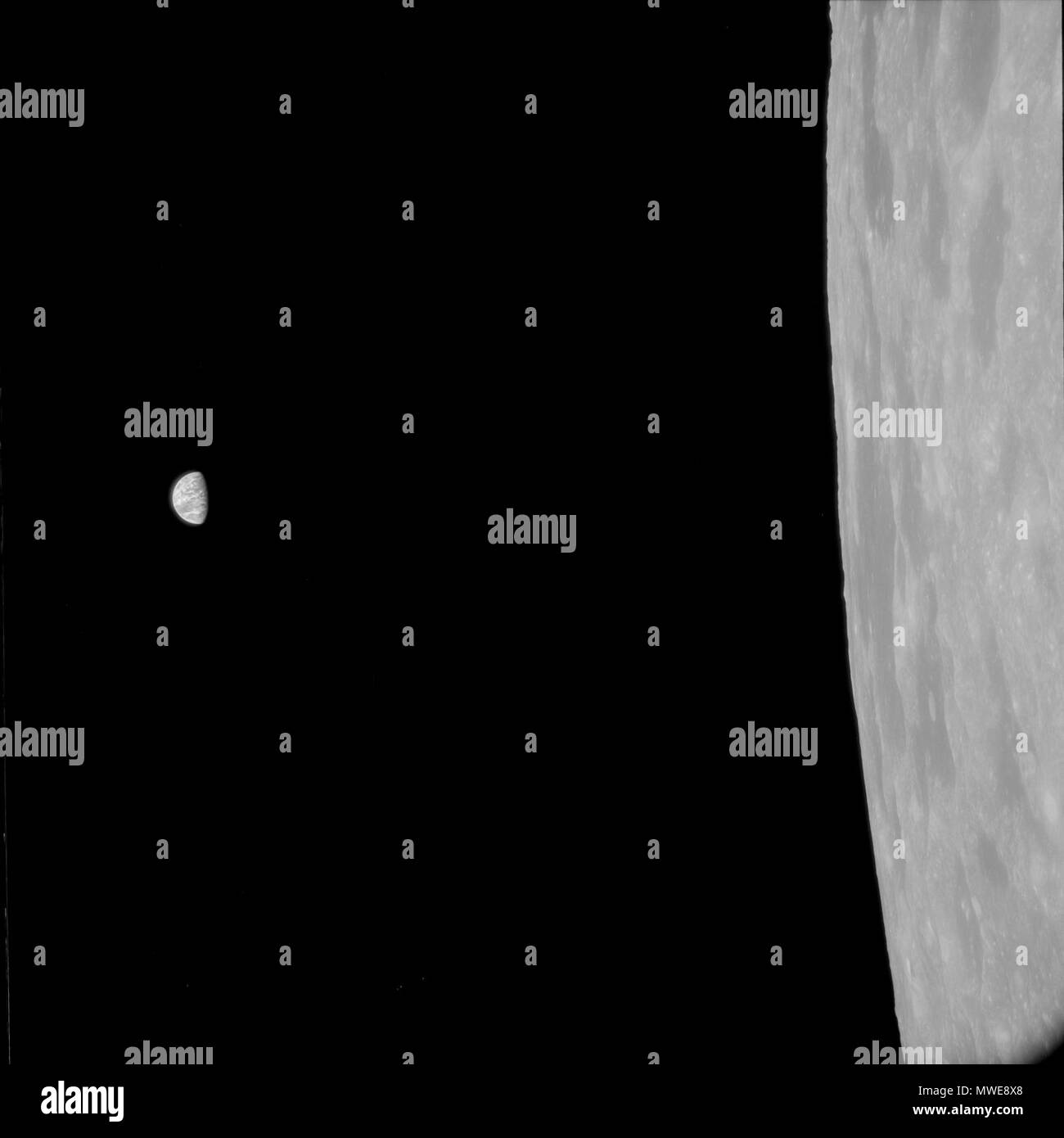 Apollo 11 mission. Lunar orbit with earth in background Stock Photo - Alamy