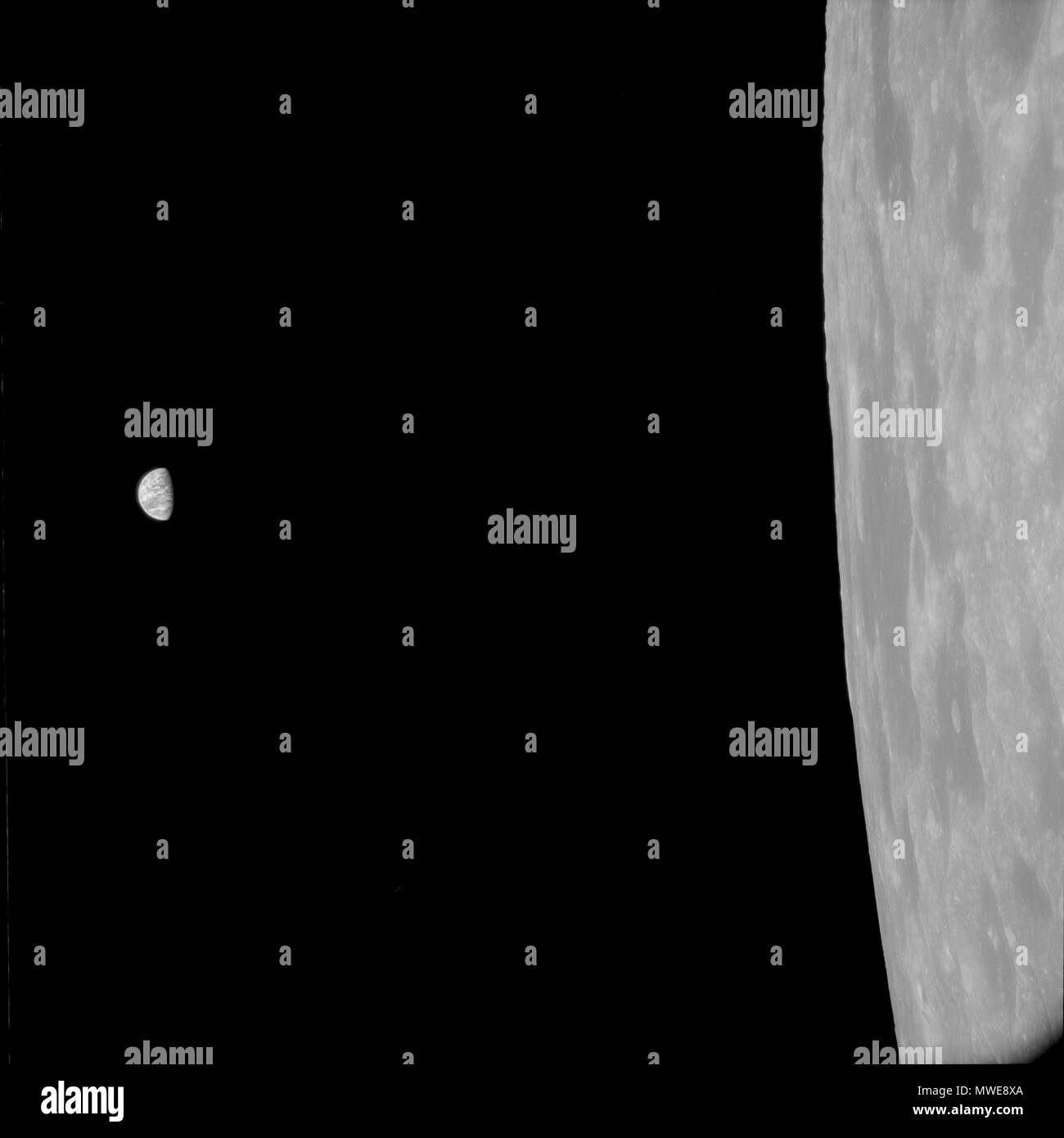 Apollo 11 mission. Lunar orbit with earth in background Stock Photo - Alamy