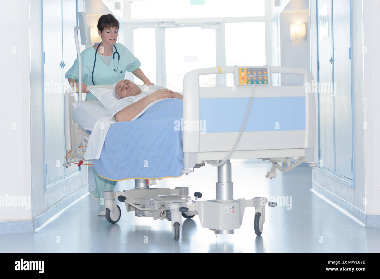 Nurse pushing bed patient hi-res stock photography and images - Alamy
