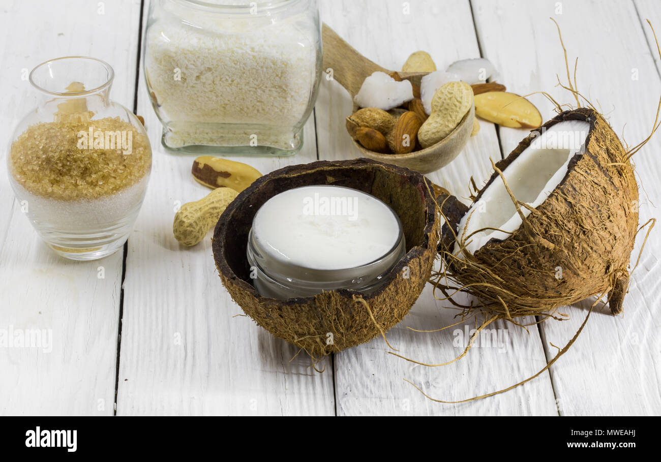 fresh coconut, coconut cream on a wooden white background ...