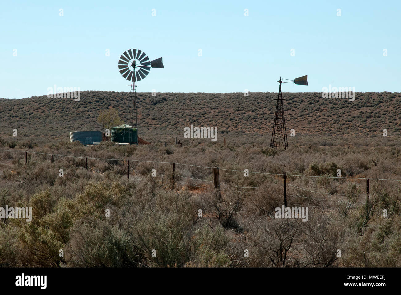 Road between Quorn and Hawker South Australia, windmill and water tanks ...