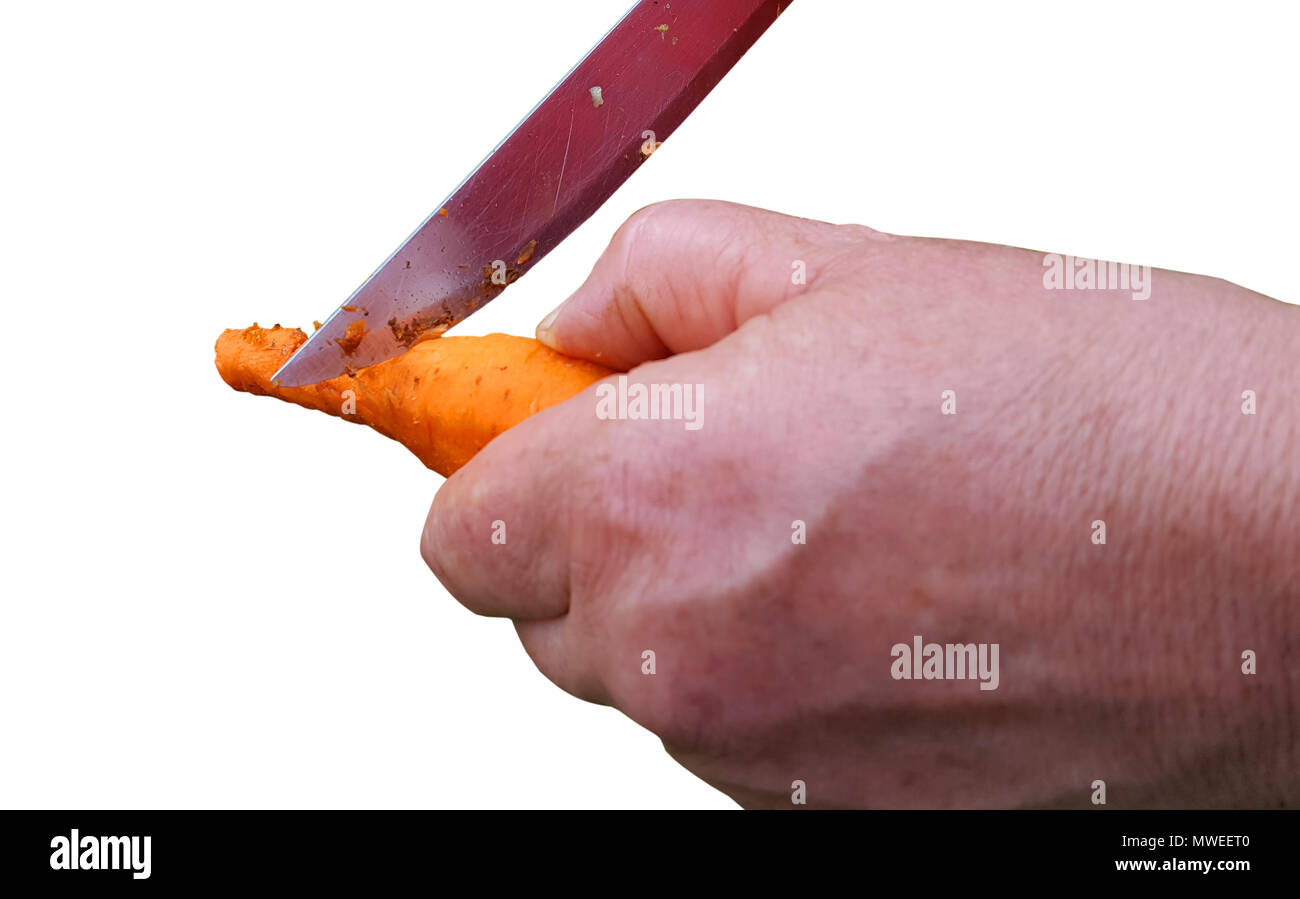 Clean carrot with knife Stock Photo - Alamy