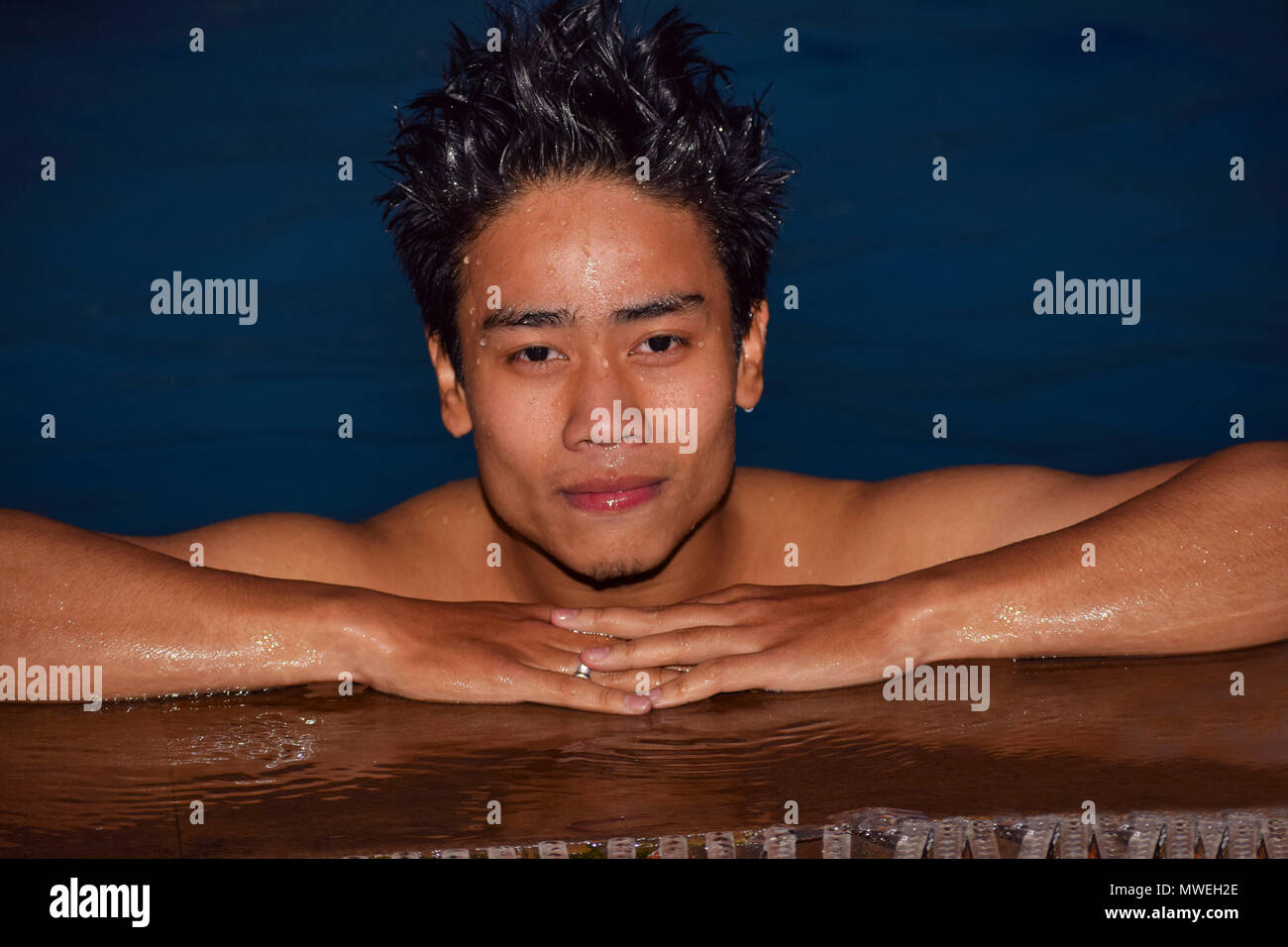Indian man outdoor swimming pool hi-res stock photography and images ...