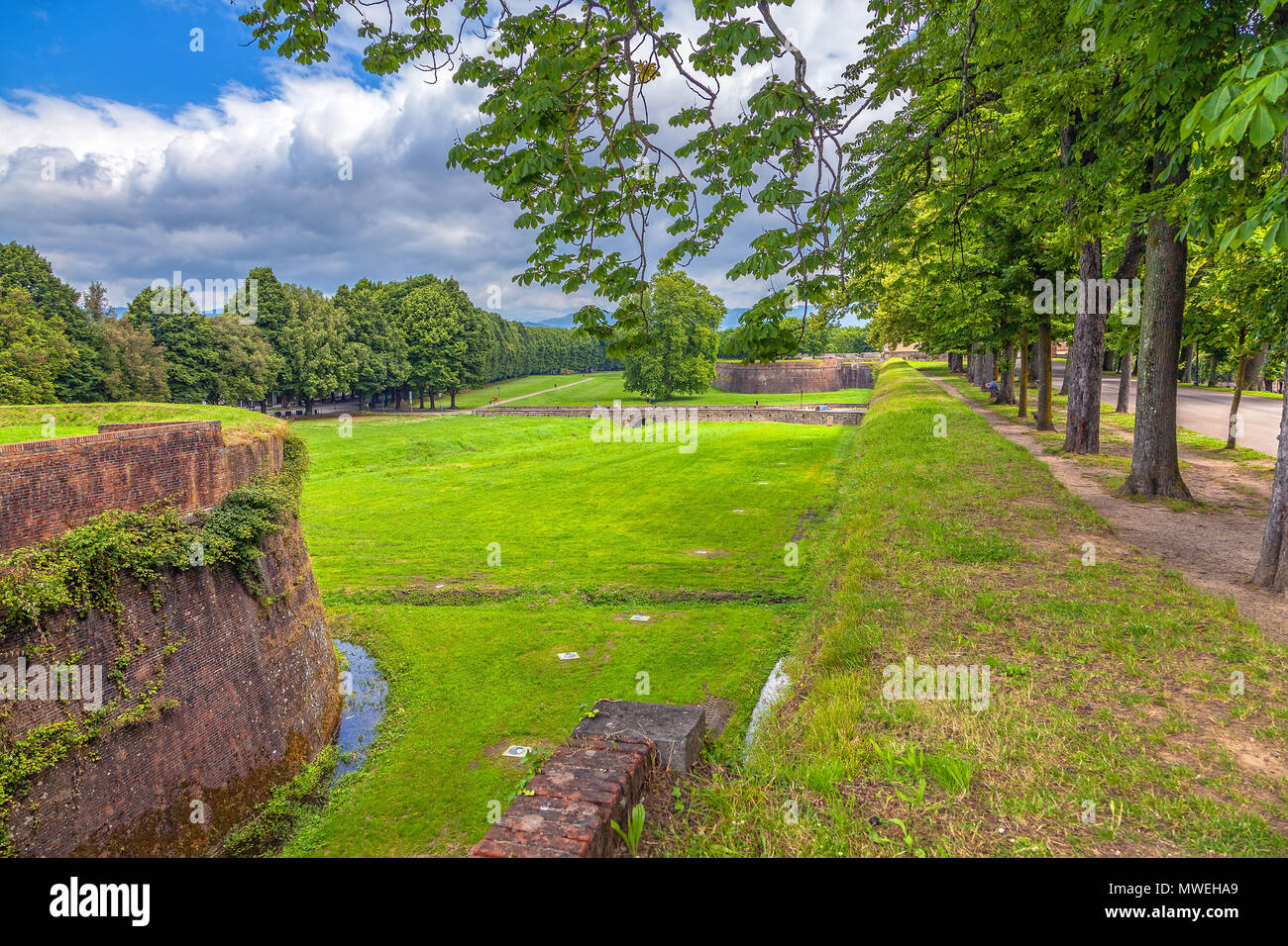 Walls of the ancient fortress in the Italian city of Lucca Stock Photo ...