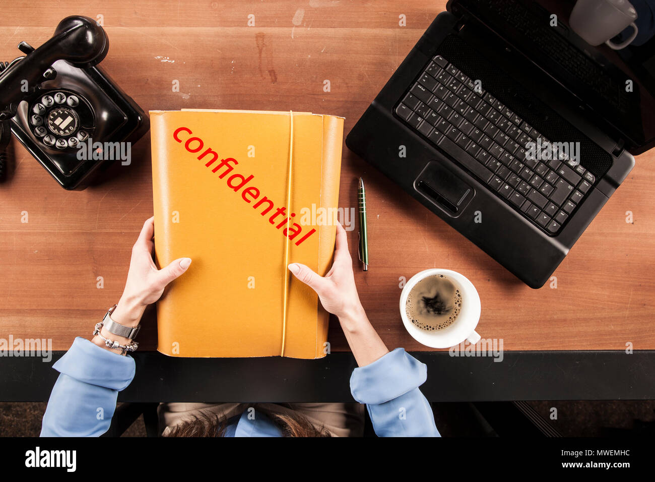 the secretary holds in his hands confidential documents, view from ...