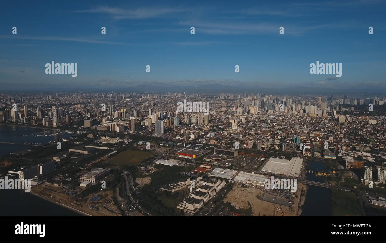 Aerial view skyline of Manila city at sunset. Fly over city with ...
