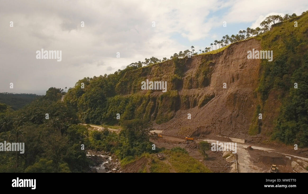 Landslides and rockfalls on the road in the mountains, Camiguin. Aerial ...