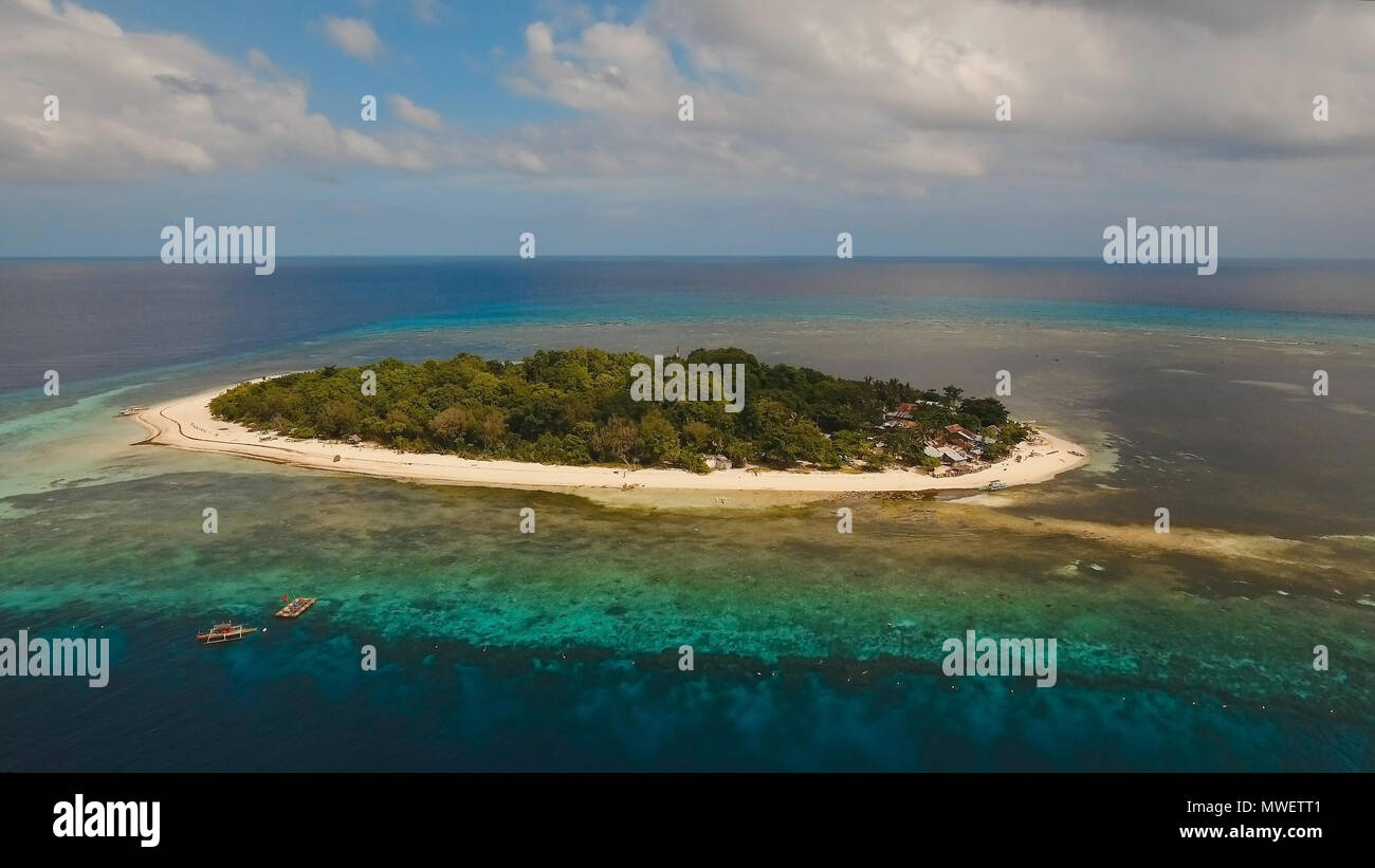 Aerial view of beautiful tropical island Mantigue with white sand beach ...