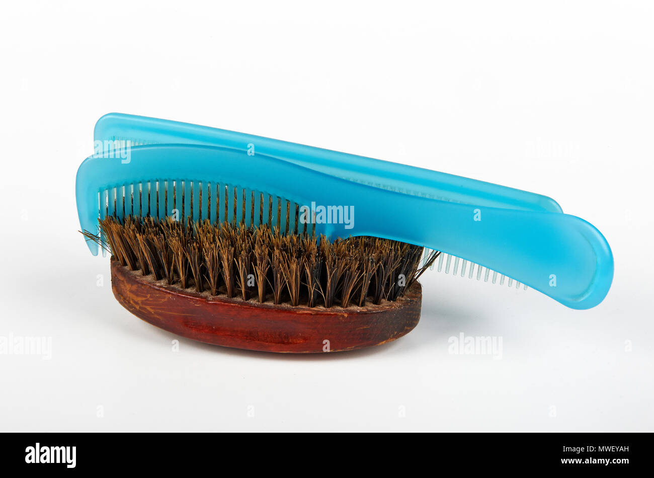 two combs and a hairbrush on white background Stock Photo - Alamy