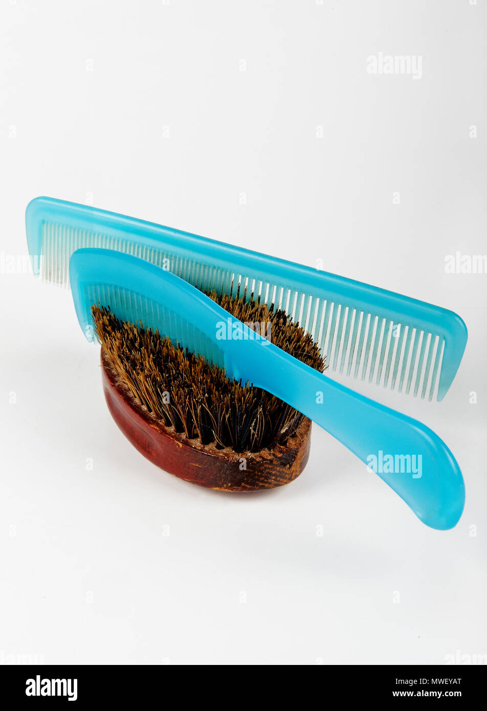two combs and a hairbrush on white background Stock Photo - Alamy