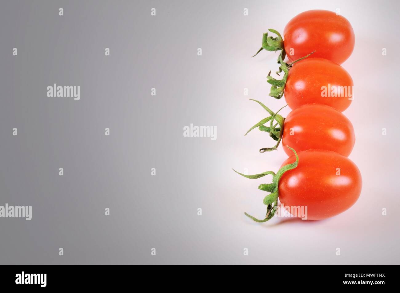 Group of traditional Italian tomatoes pachino on gray background Stock ...