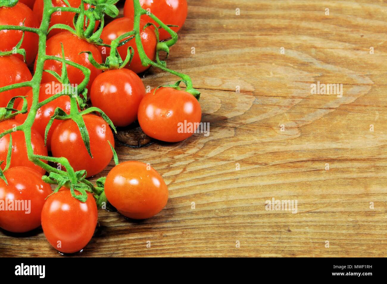 Group of traditional Italian tomatoes pachino on wooden background ...