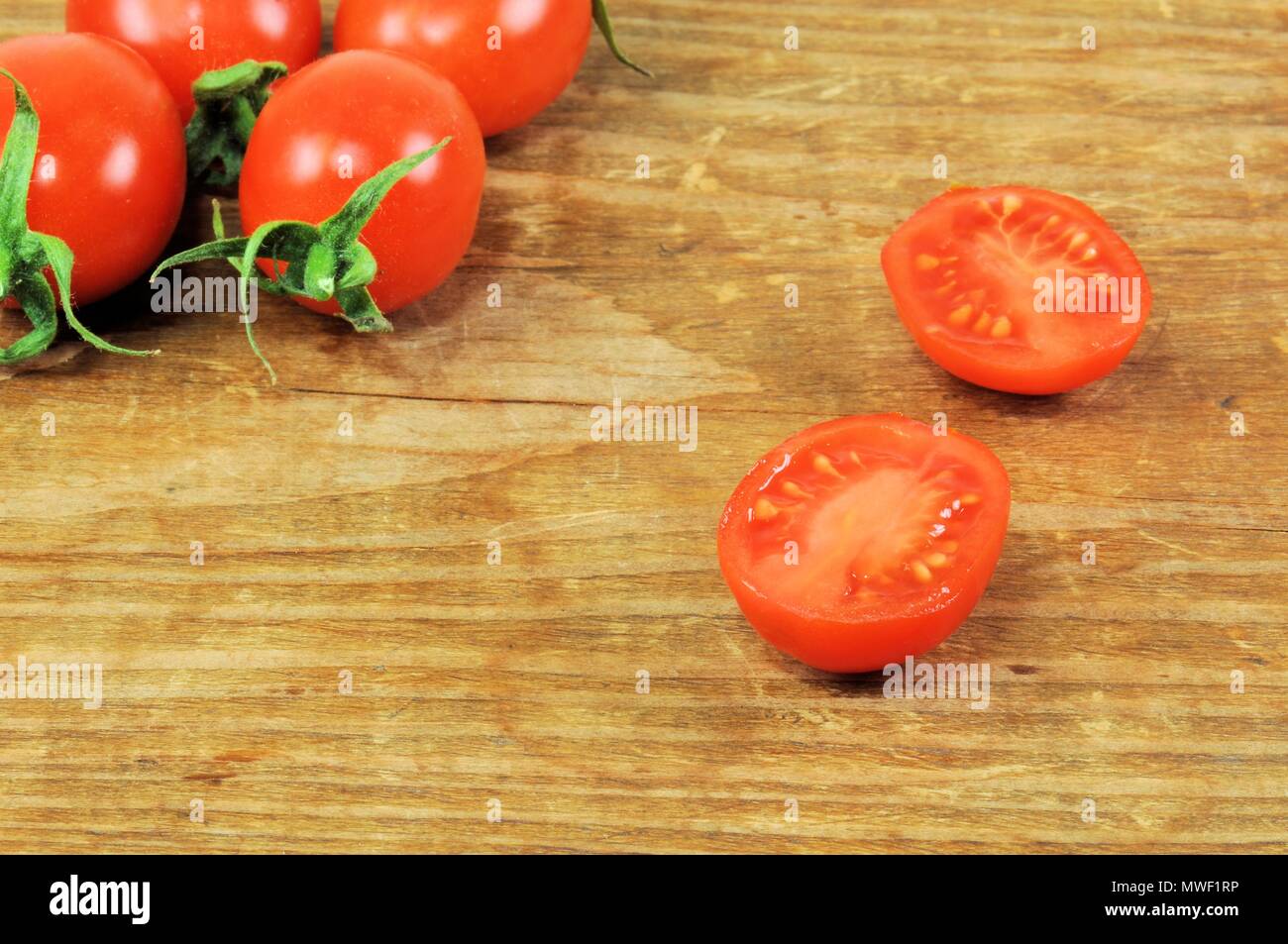 Group of traditional Italian tomatoes pachino on wooden background ...