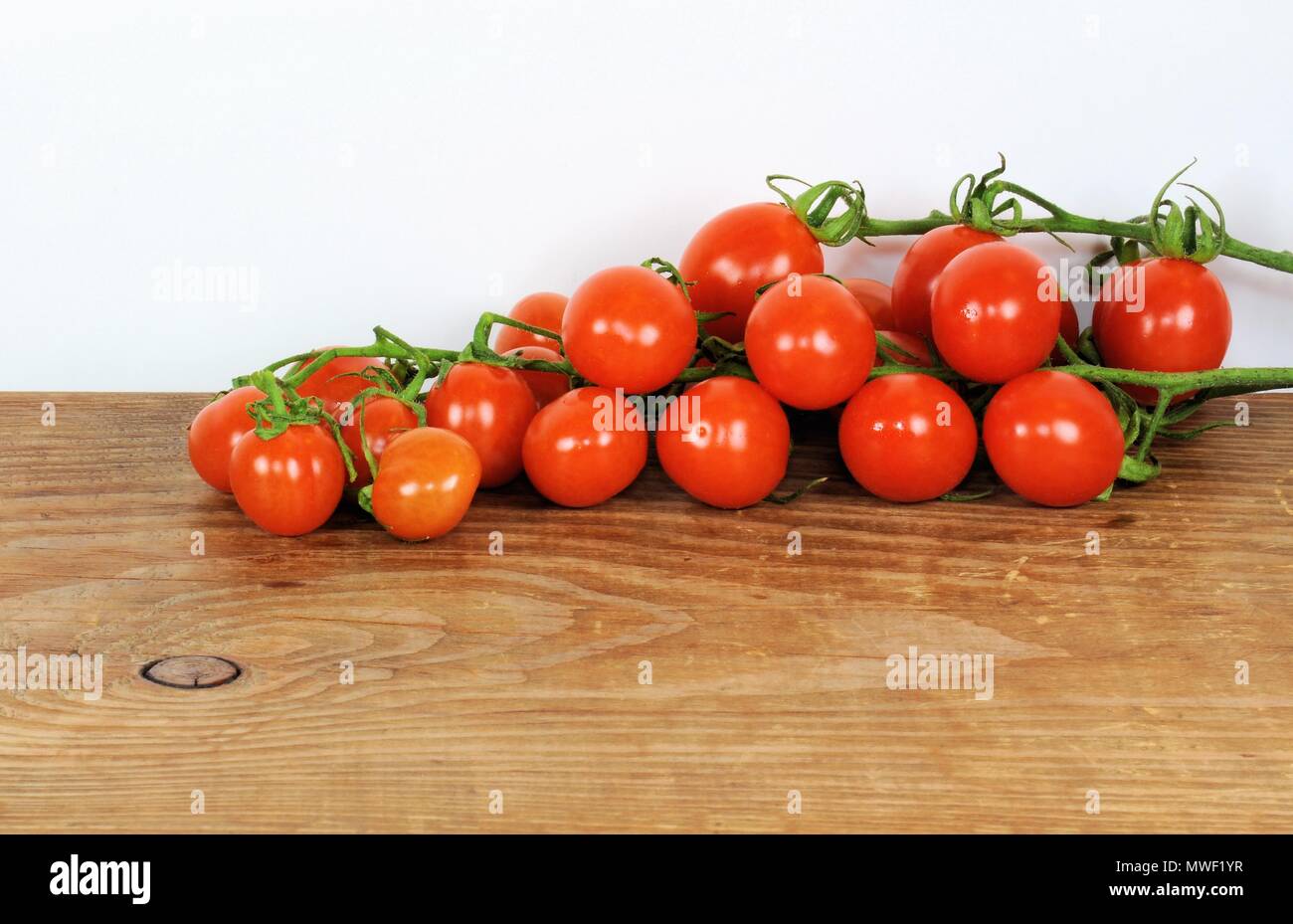 Group of traditional Italian tomatoes pachino on wooden background ...