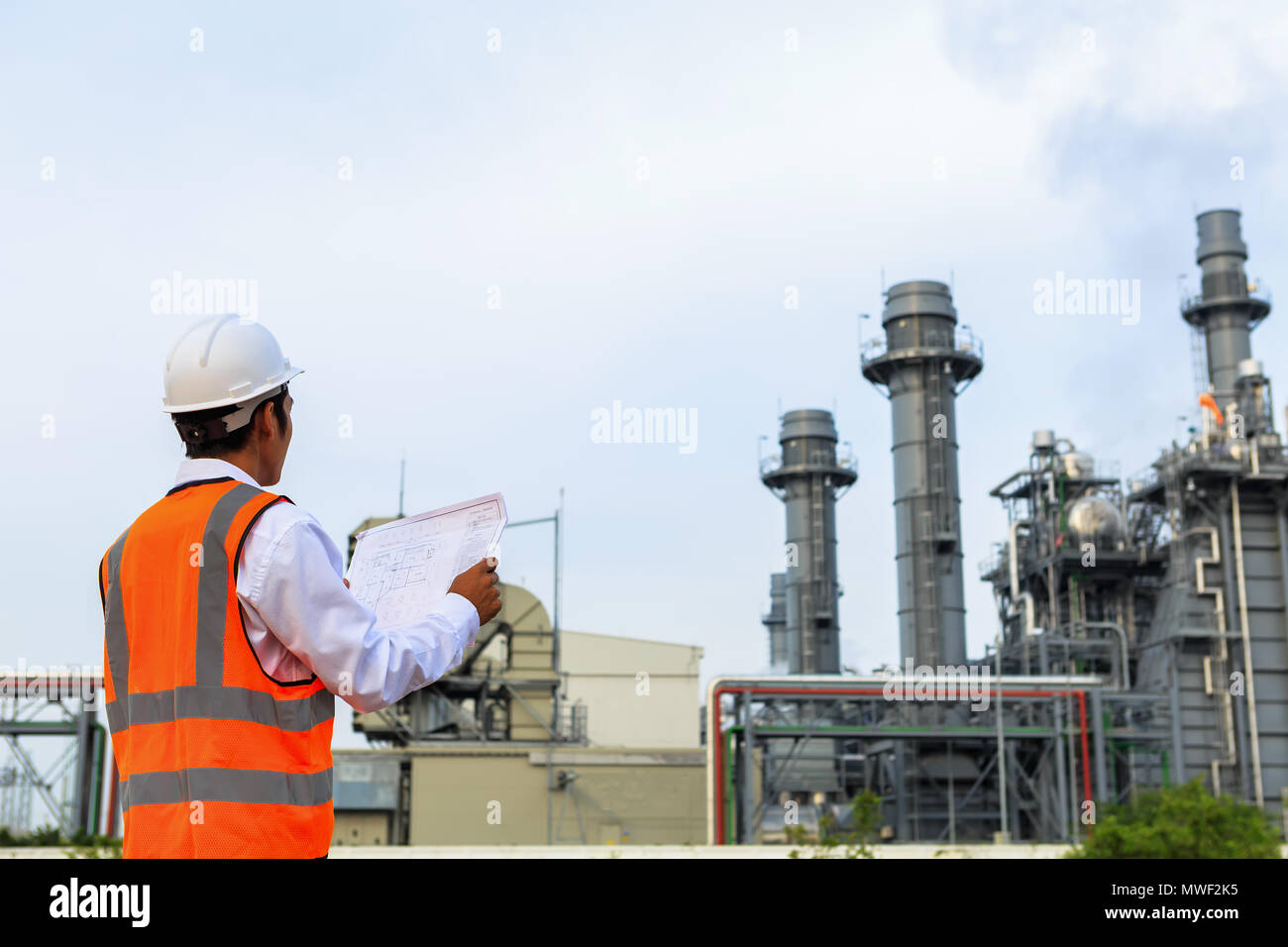 Engineer is checking plant around Gas turbine electrical power plant ...