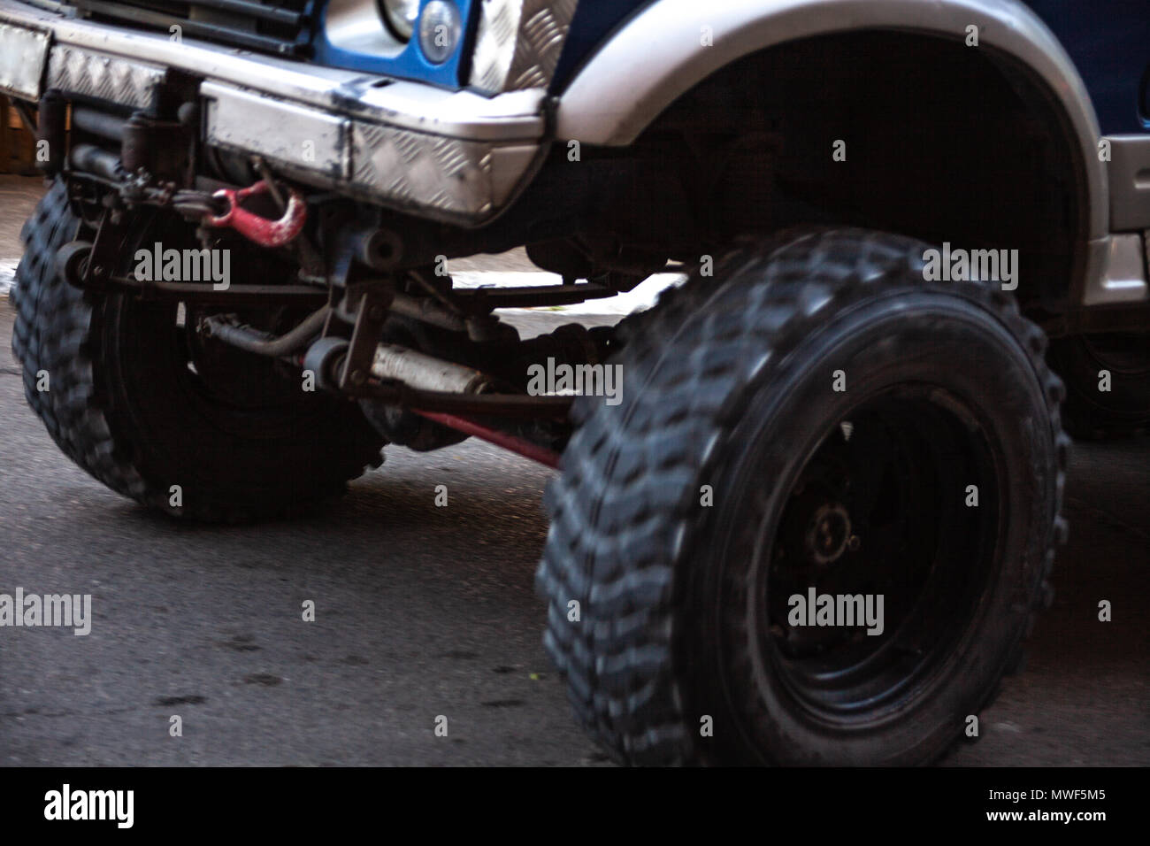 Big truck with big wheels on the road. Blurred motion on the moving ...