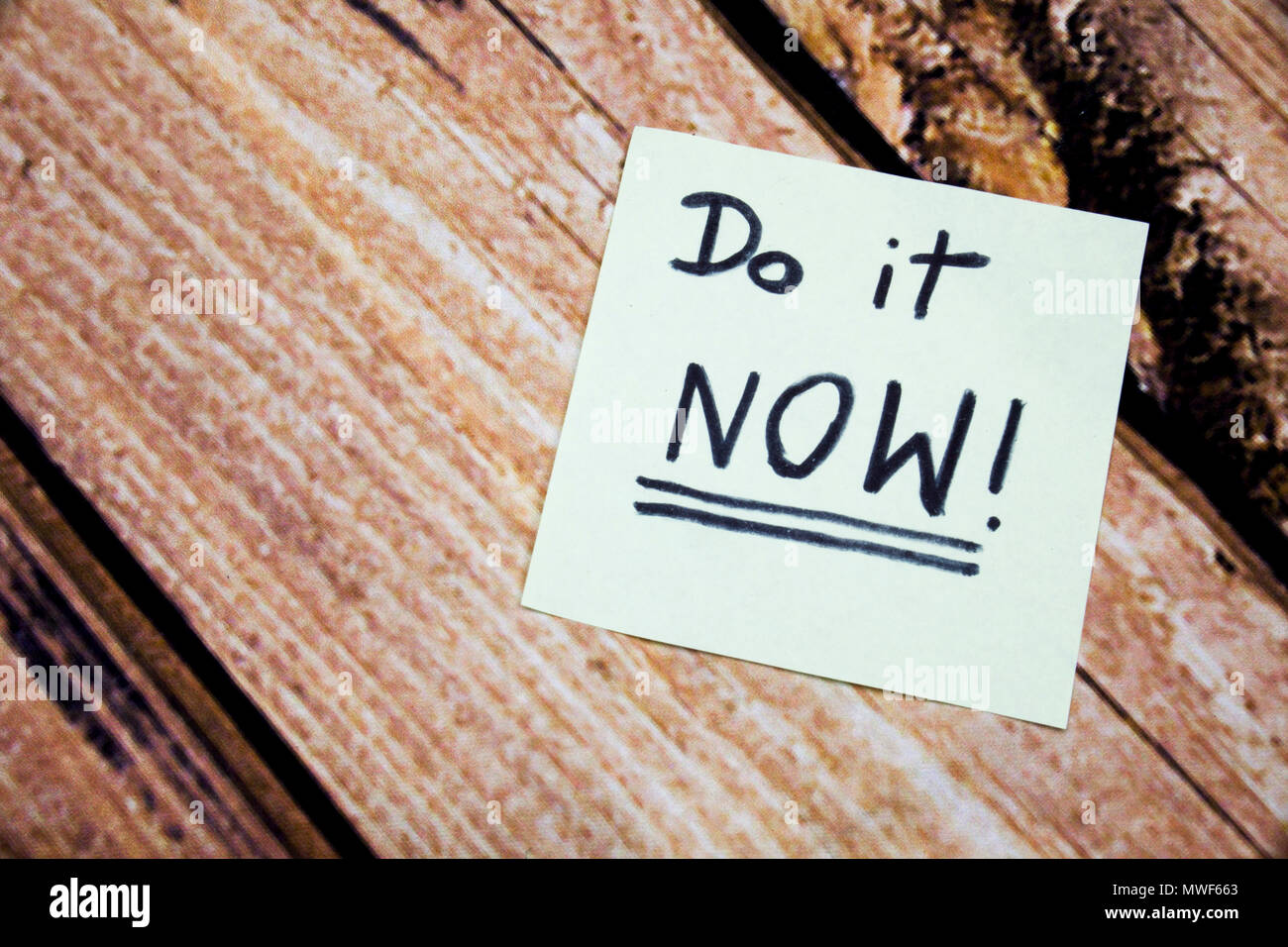 Do it now conceptual handwritten message on the white paper. Business ...