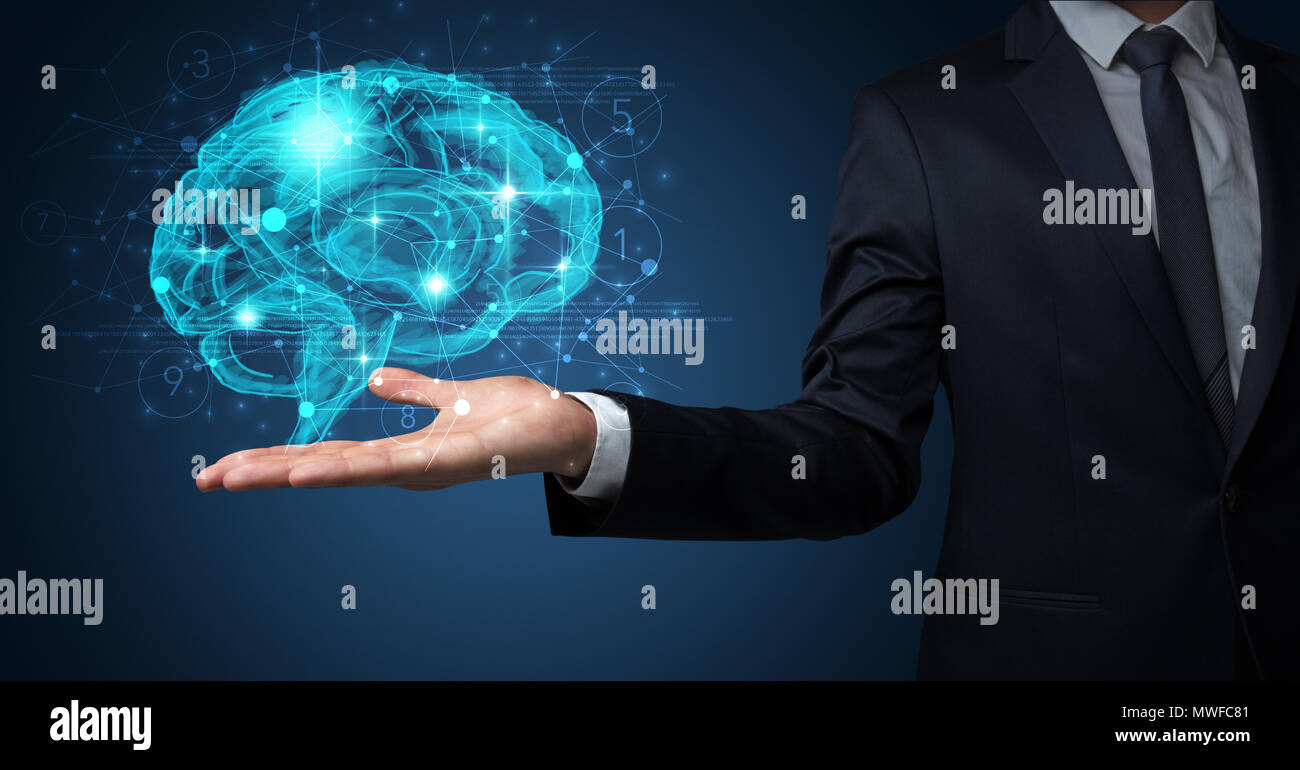 Businessman holding human brain on his hand with logistics symbols ...