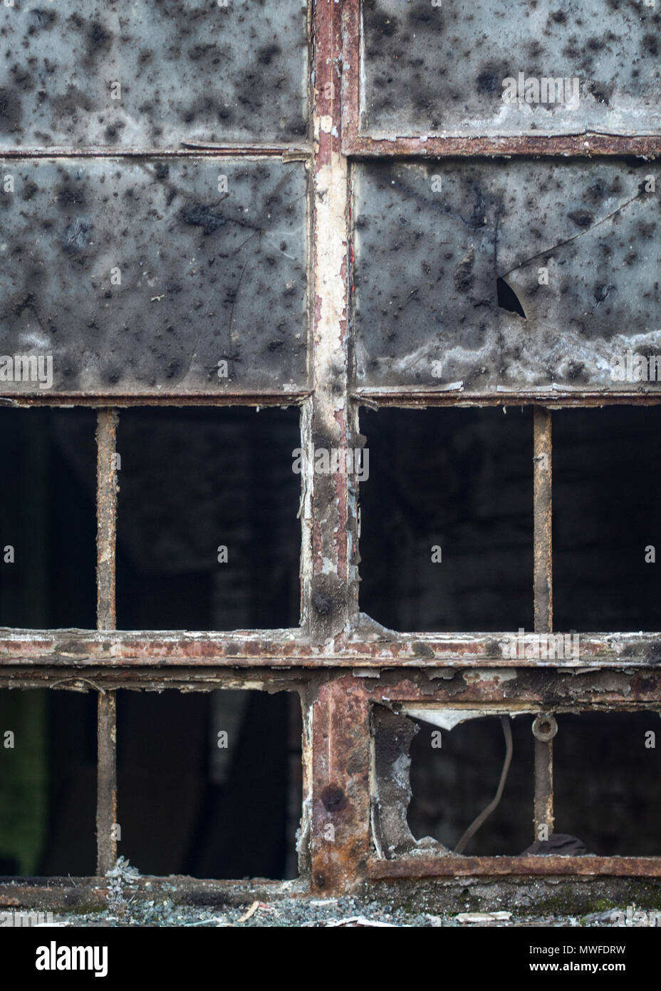 Abandoned building broken window frames and urban decay Stock Photo - Alamy