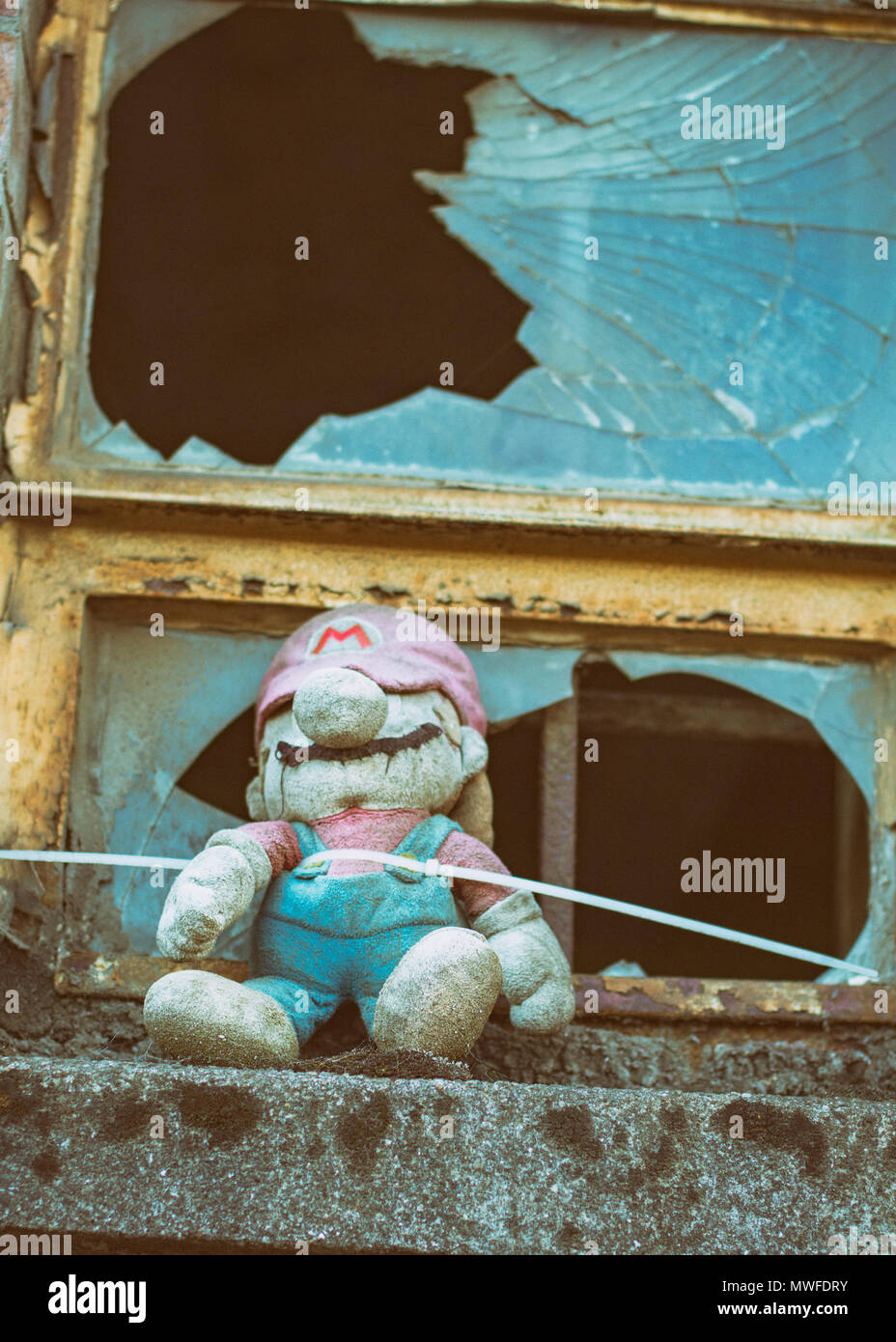 Super Mario in a grubby broken window frame Stock Photo - Alamy