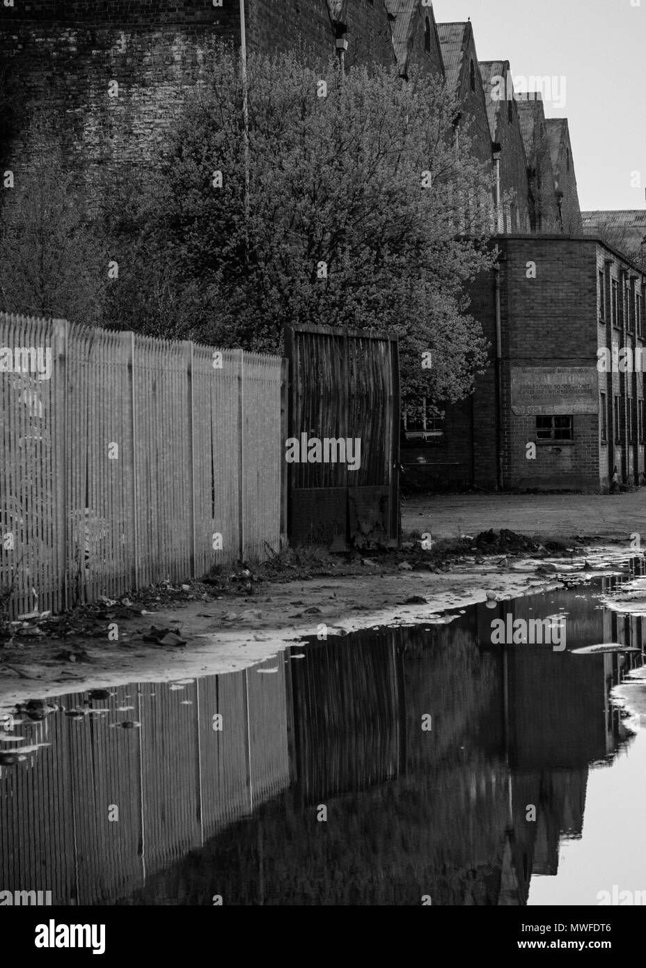 Abandoned building broken window frames and urban decay Stock Photo - Alamy