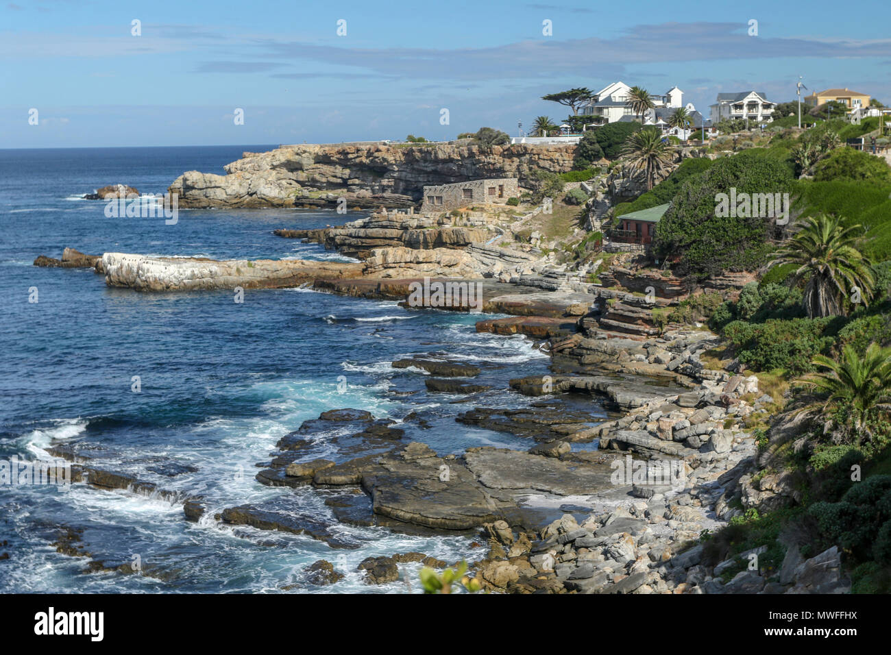 Dramatic rocks sea and blue sky along the hermanus cliff path on the ...