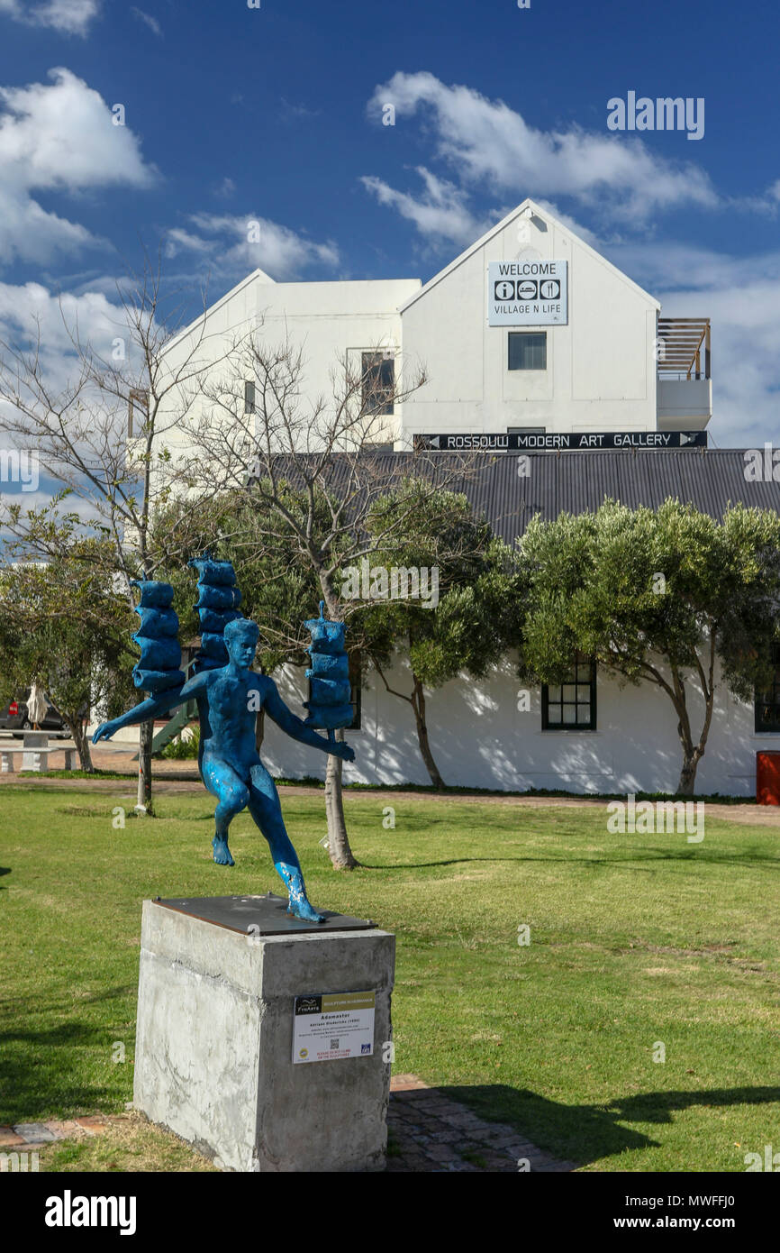Hermanus centre architecture with statue on the green in the autumn ...