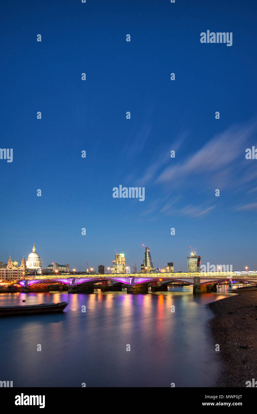 Stunning London City skyline landscape at night with glowing city ...