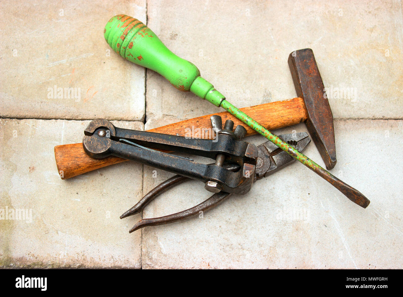 Old rusty tools must be replaced with new ones Stock Photo - Alamy