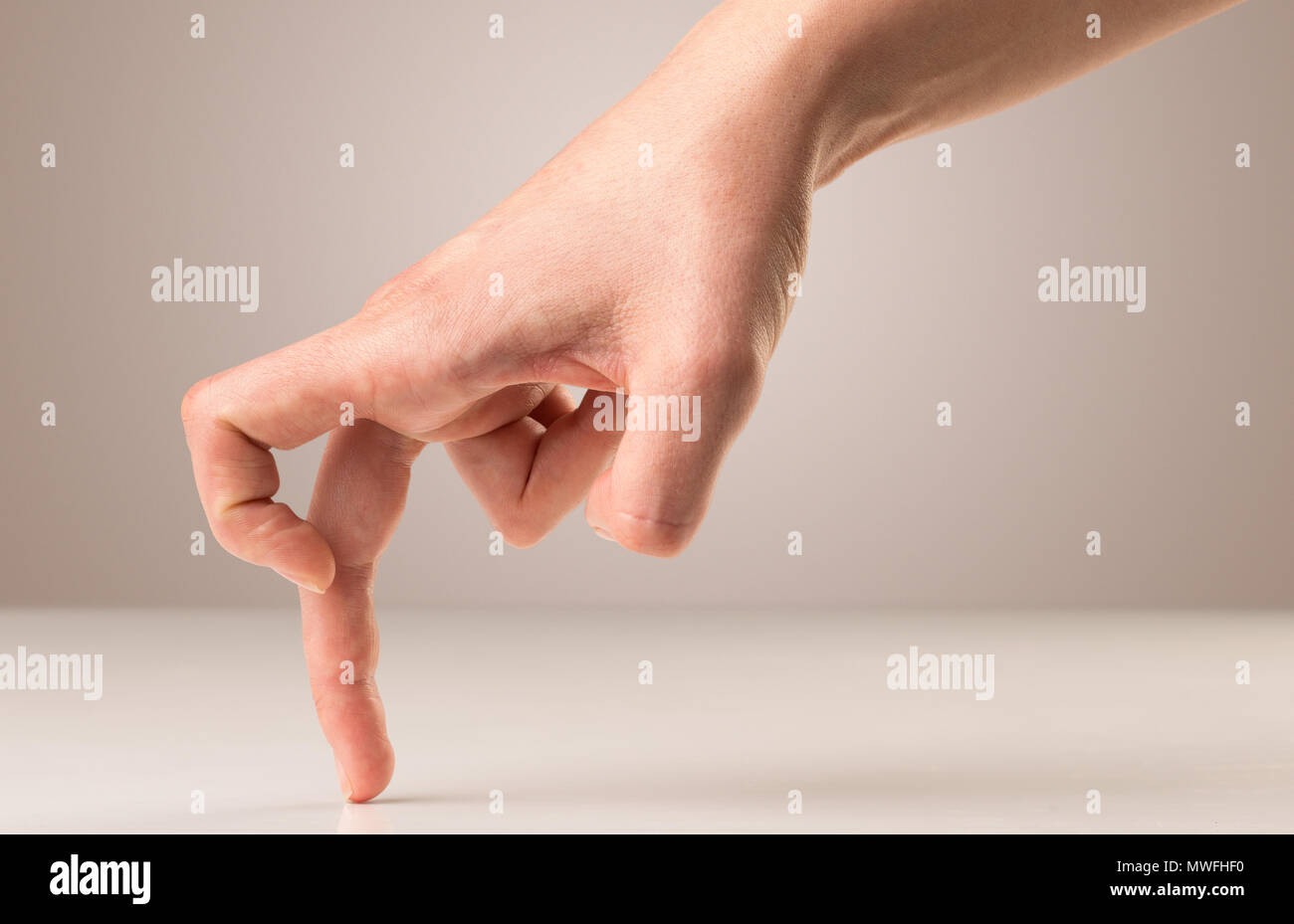 Female fingers walking on white surface Stock Photo - Alamy