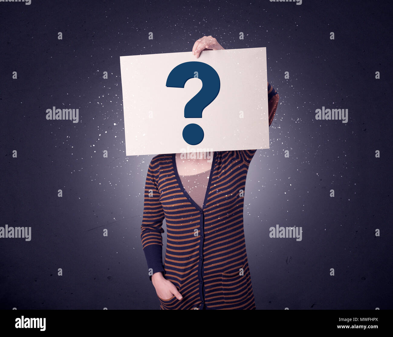 Young casual woman hiding behind a question mark drawn on paper Stock ...