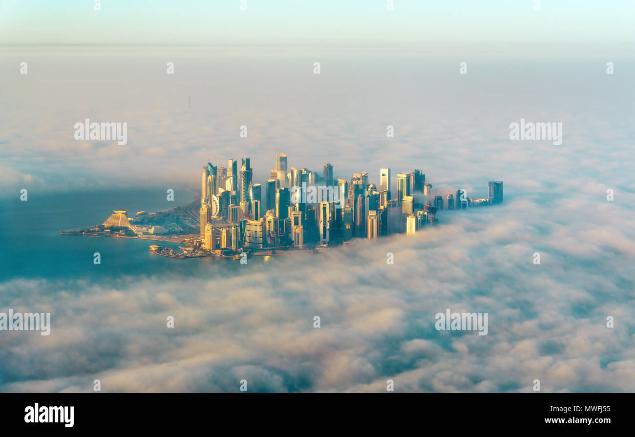 Aerial view of Doha through the morning fog - Qatar, the Persian Gulf ...