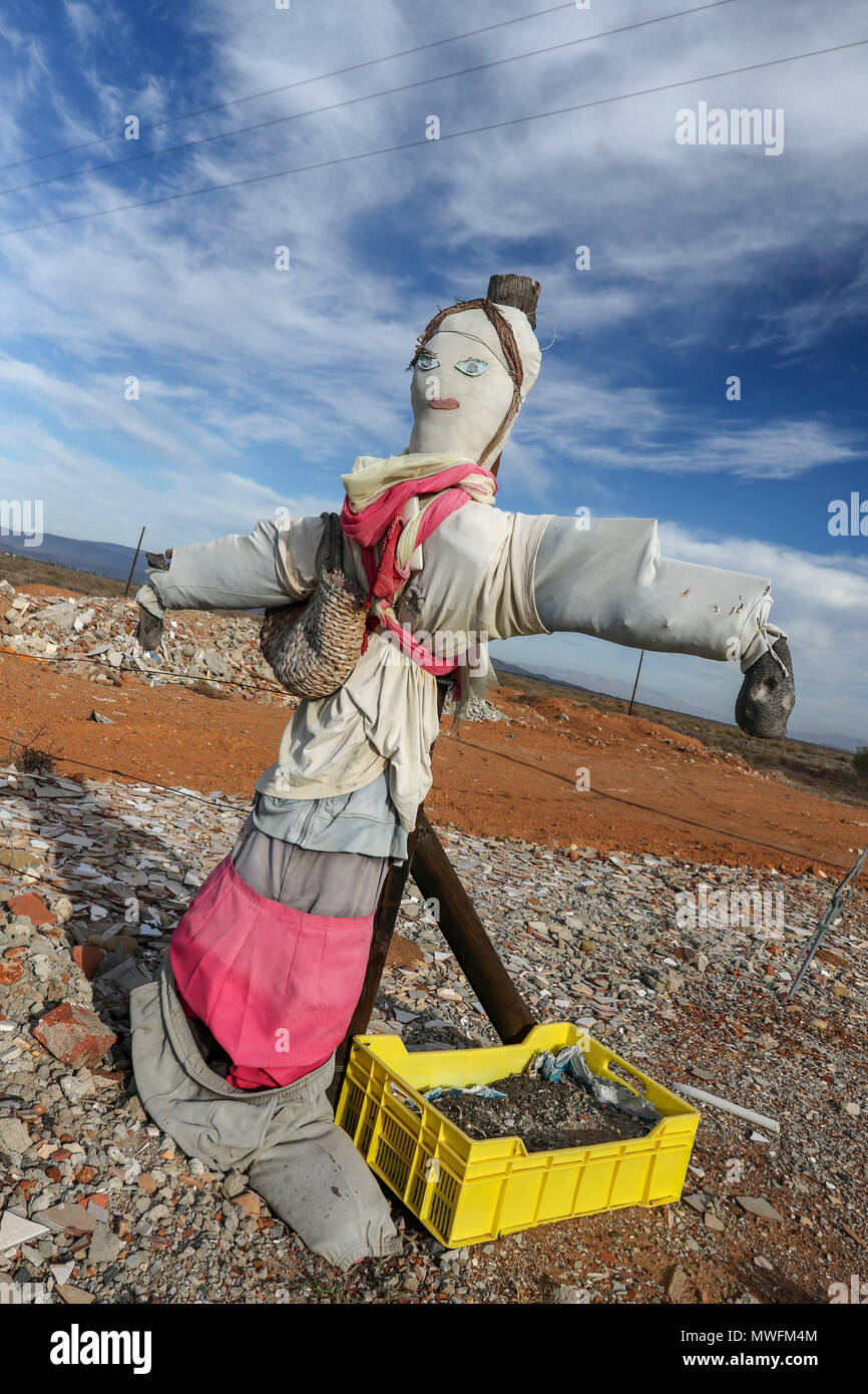 Colourful scarecrow woman in the landscape, Oudtshoorn, garden route ...