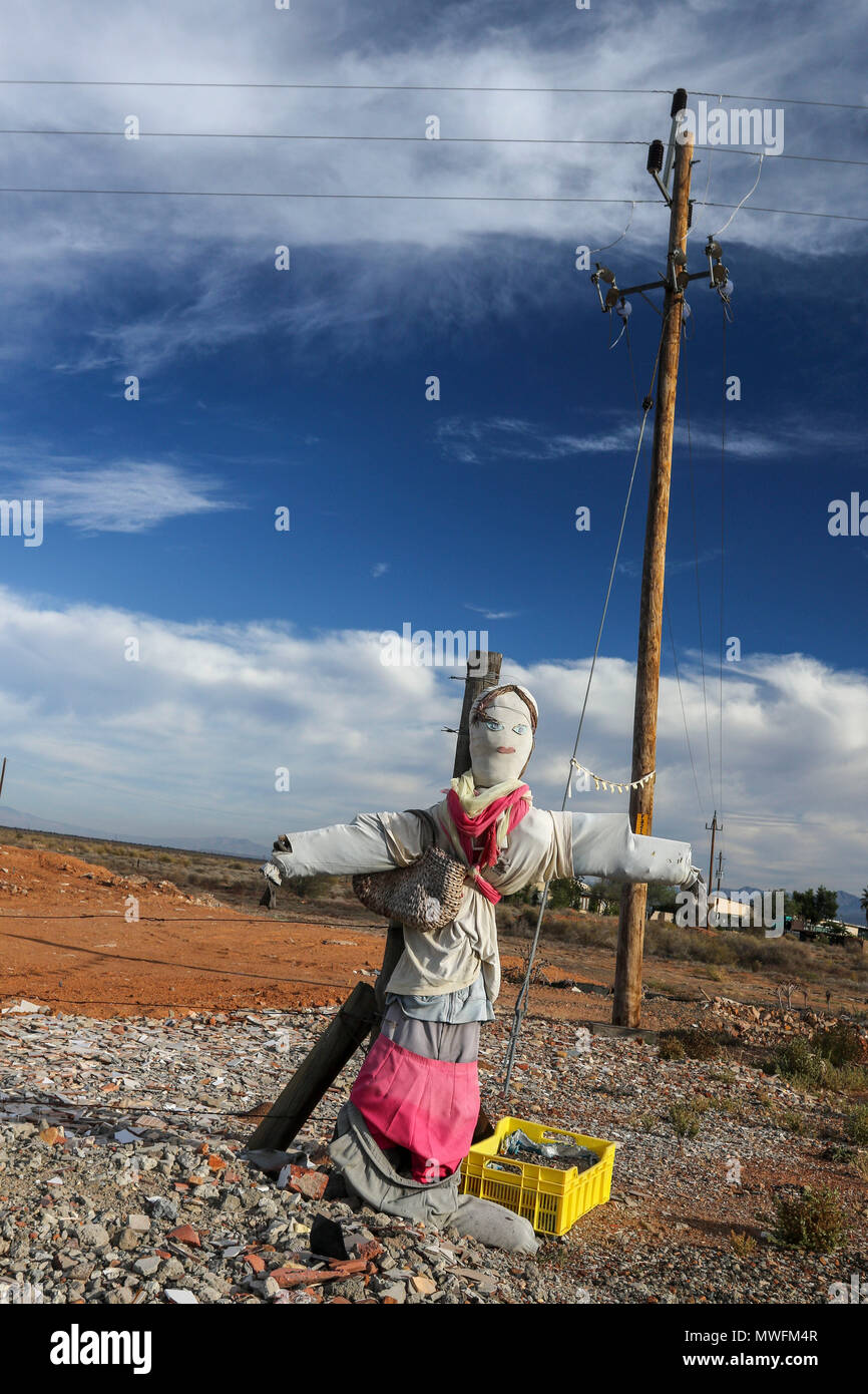 Colourful scarecrow woman in the landscape, Oudtshoorn, garden route ...