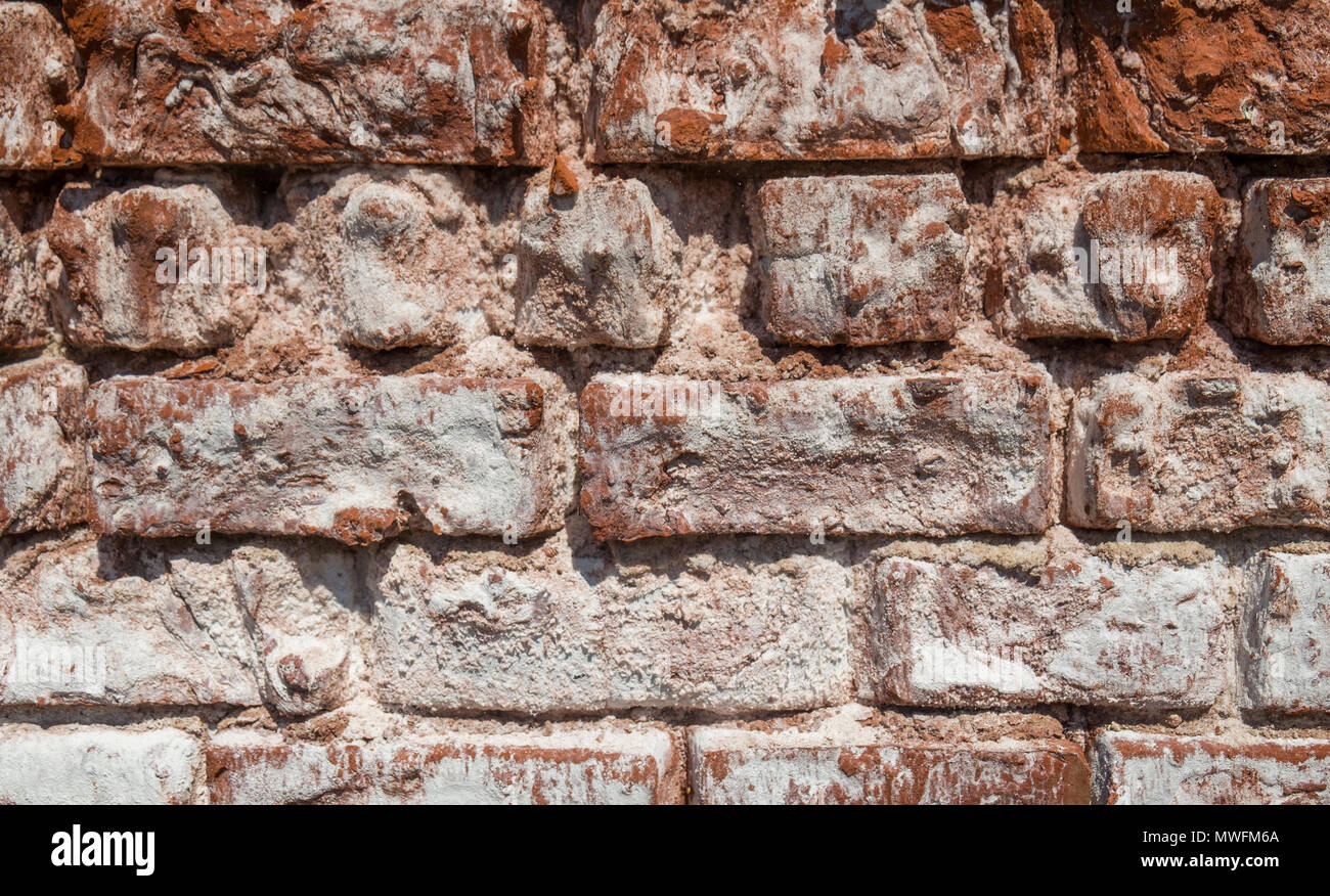 old brick wall showing weathered texture Stock Photo - Alamy