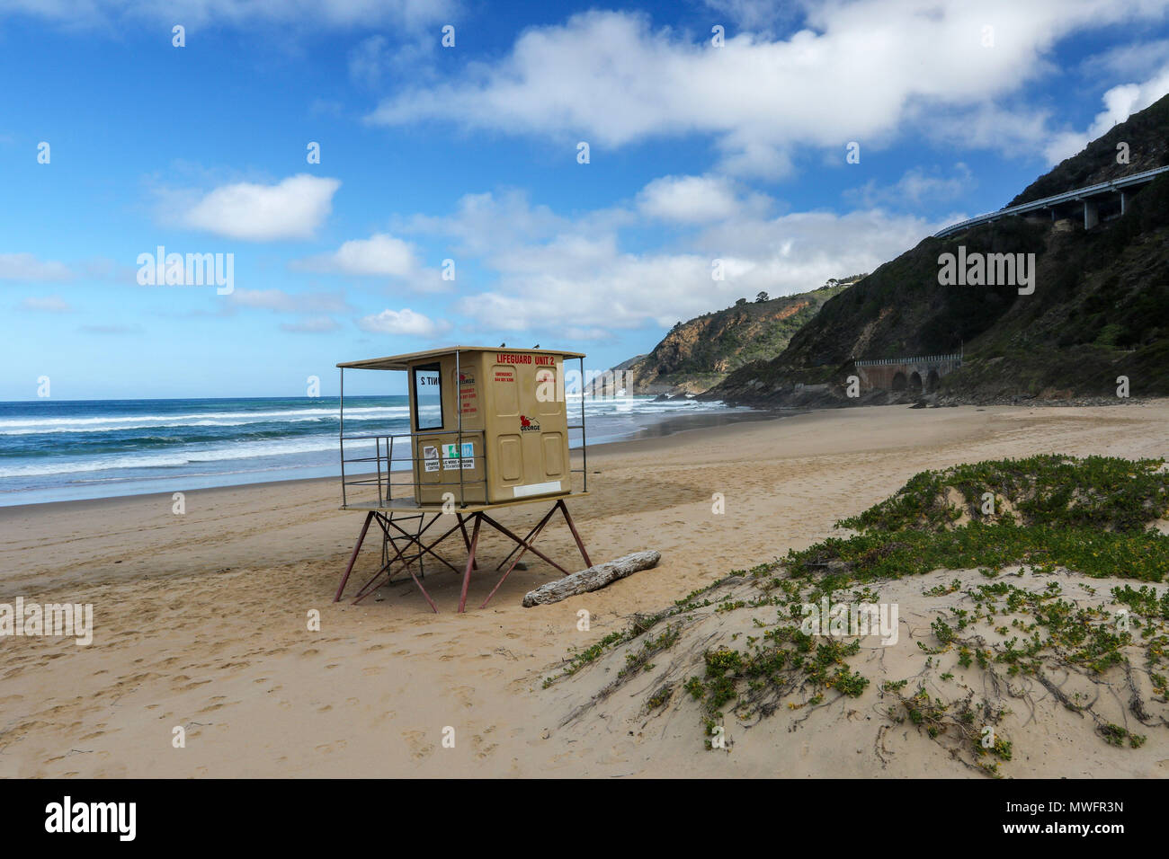 Lifeguard station under blue sky and white clouds on wilderness beach ...