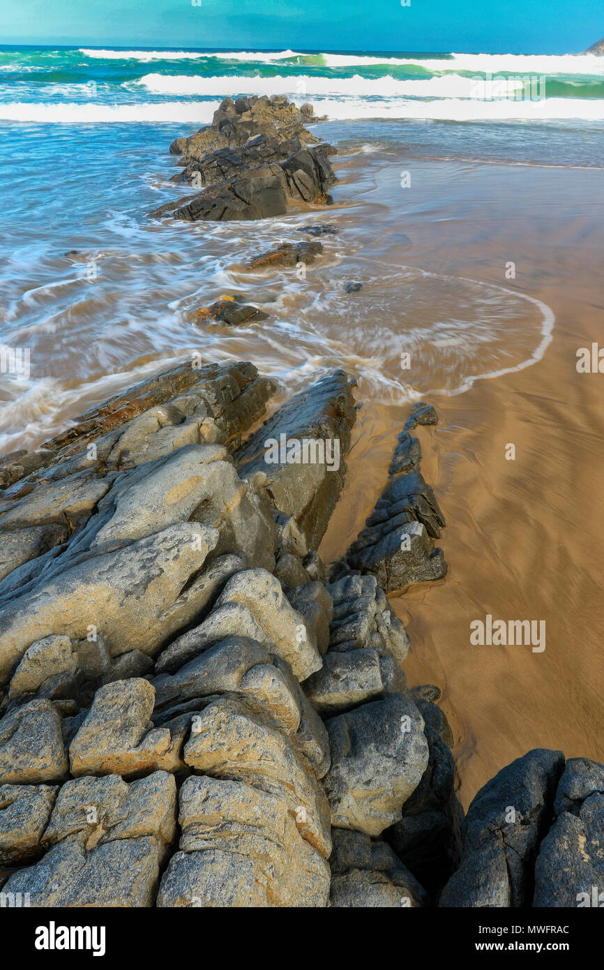 Rock outcrop and tide on Wilderness beach, wildernessss, garden route ...