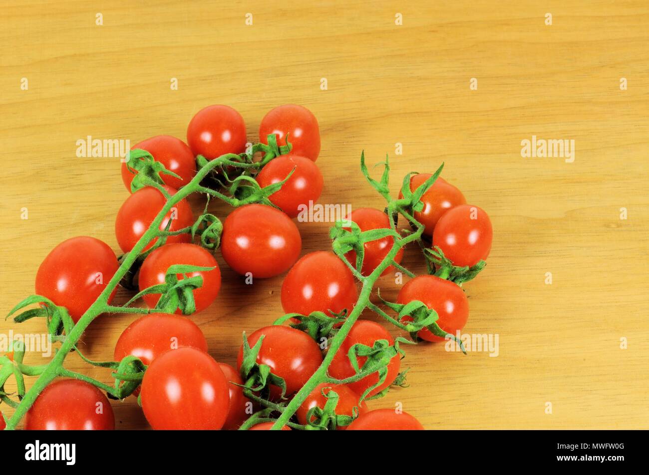 Group of traditional Italian tomatoes pachino on wooden background ...