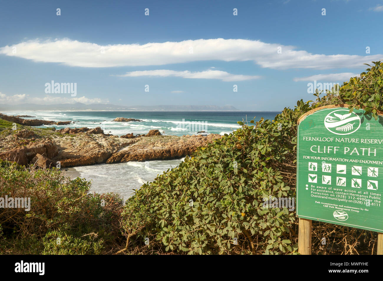 Dramatic rocks sea and blue sky along the hermanus cliff path on the ...