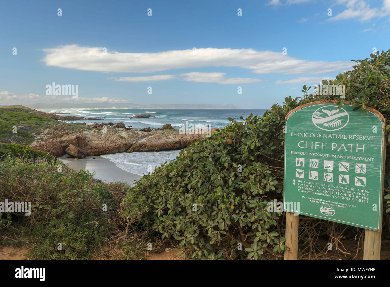 Dramatic rocks sea and blue sky along the hermanus cliff path on the ...