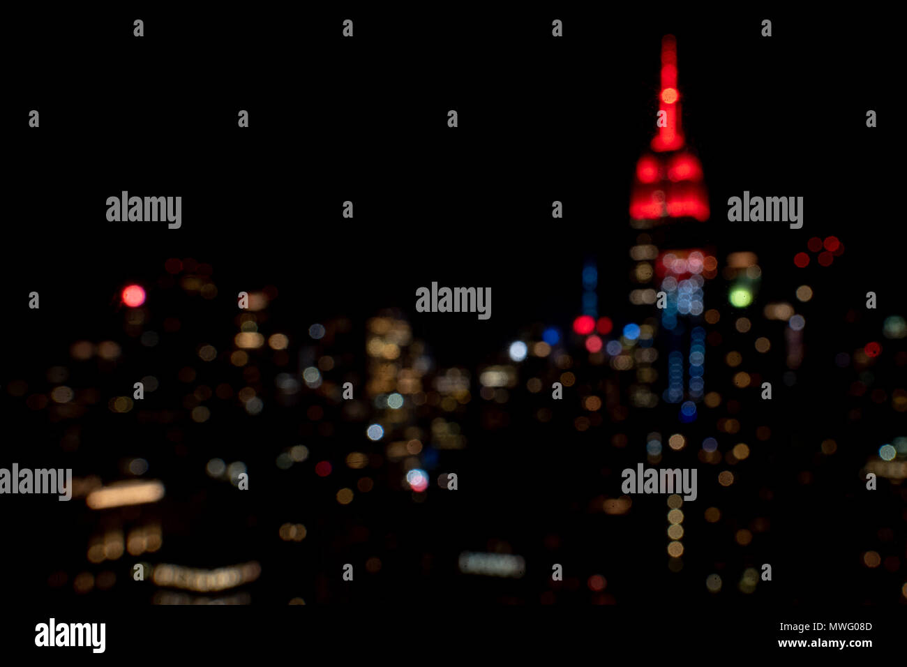 blur view at night skyscraper building new york city Stock Photo - Alamy
