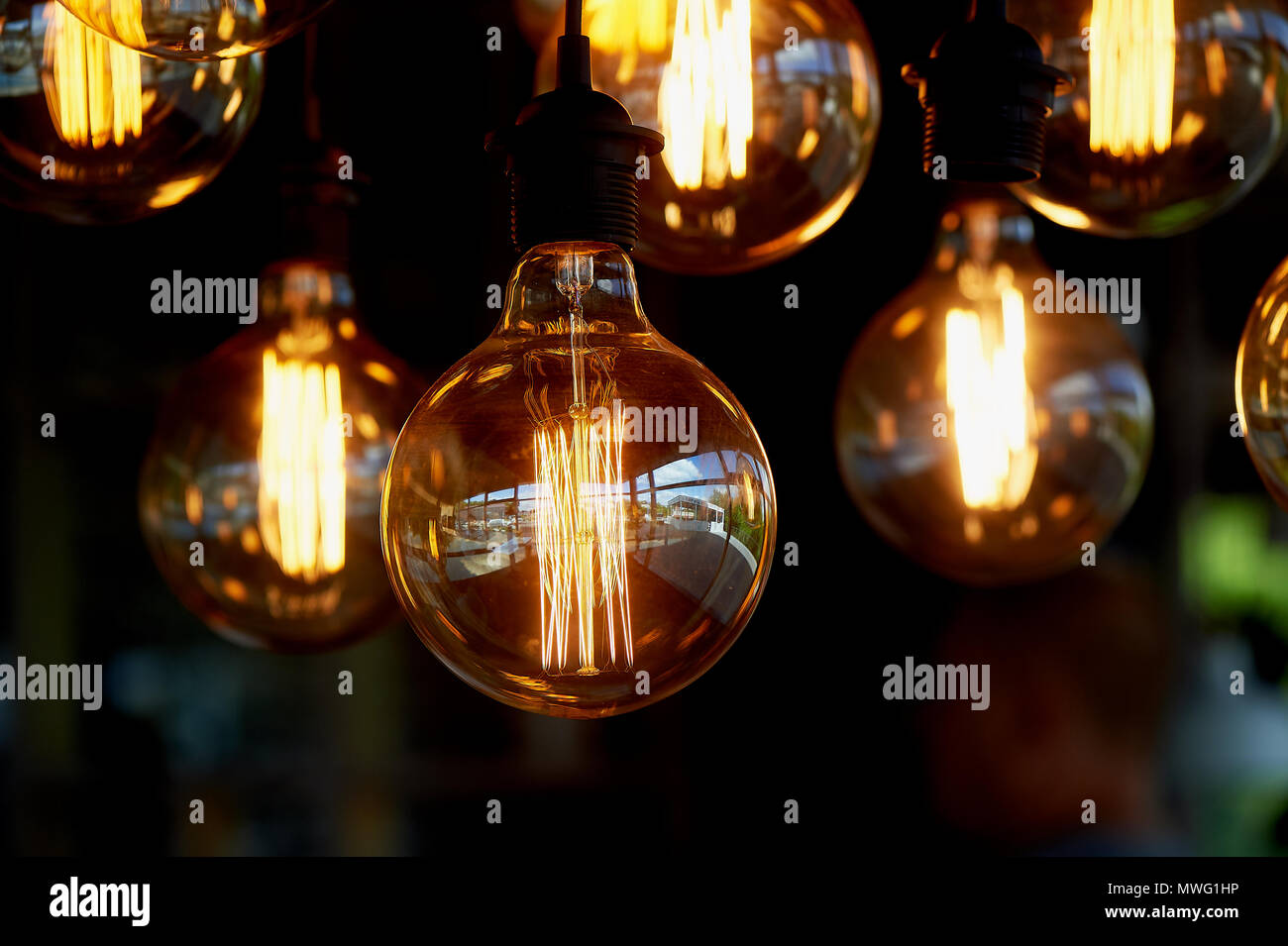 Hanging lightbulbs hi-res stock photography and images - Alamy