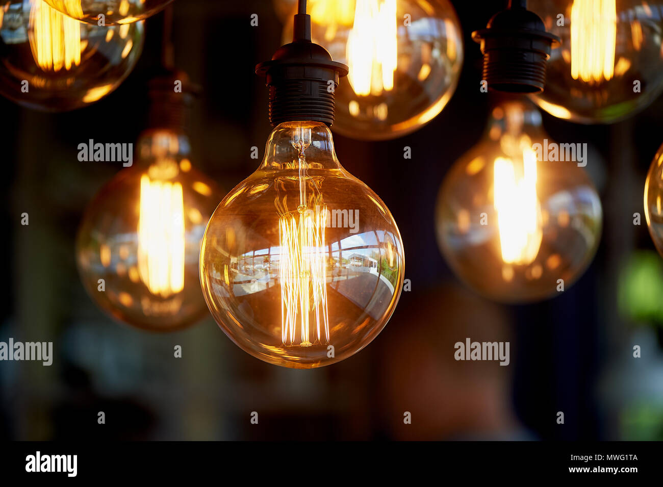 Edison light bulb hanging on a long wire. Cozy warm yellow light.Retro ...