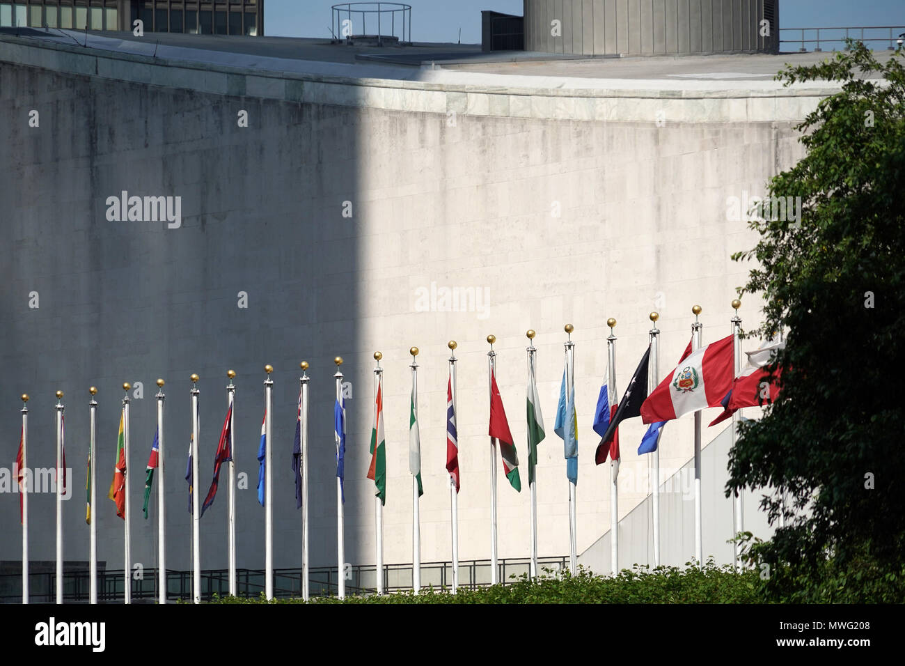 flags waving outside united nations building in manhattan new york ...