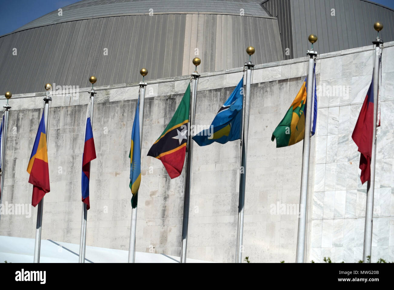 flags waving outside united nations building in manhattan new york ...